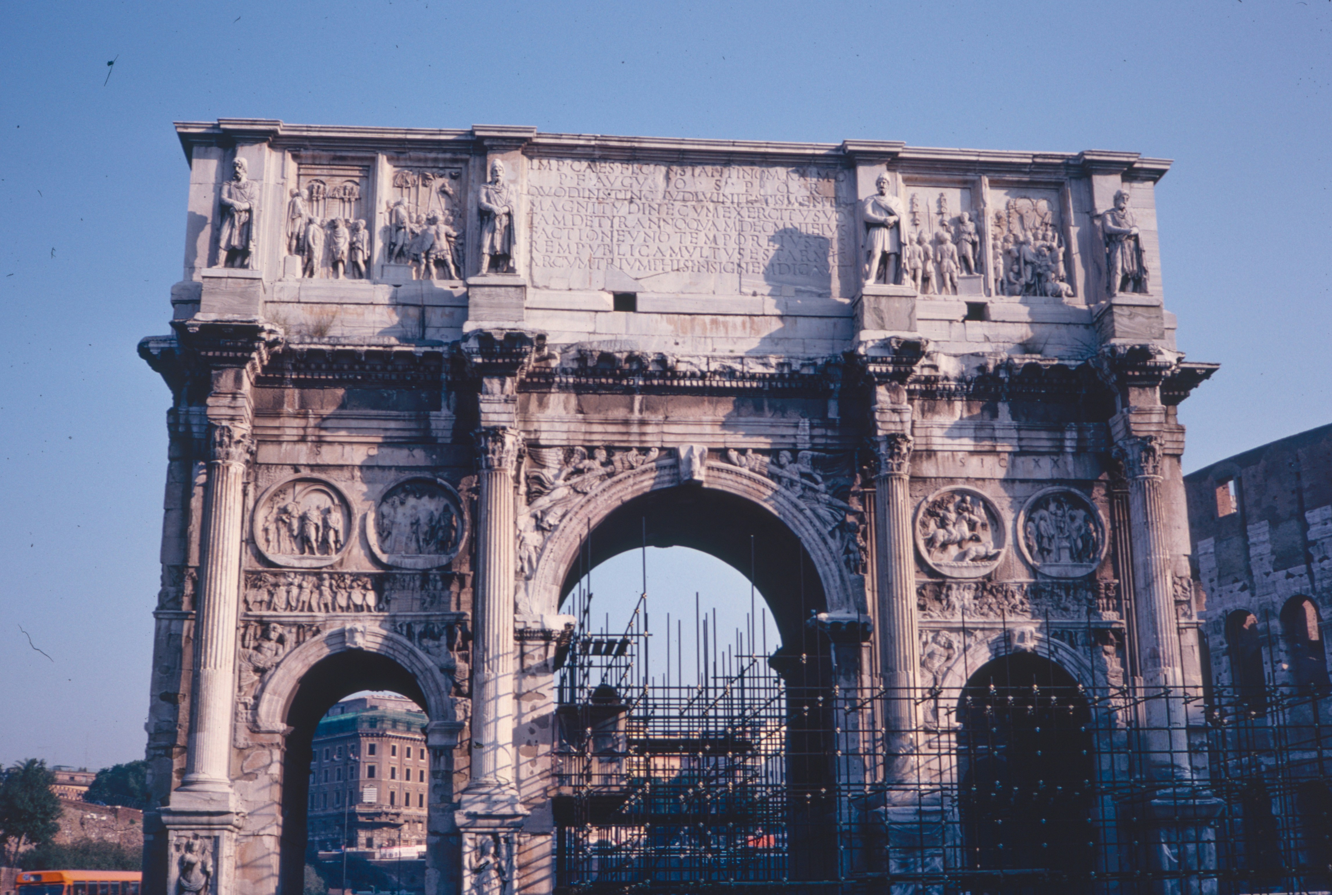 Central Archway Under Restoration: A Roman Monument in Blue Daylight