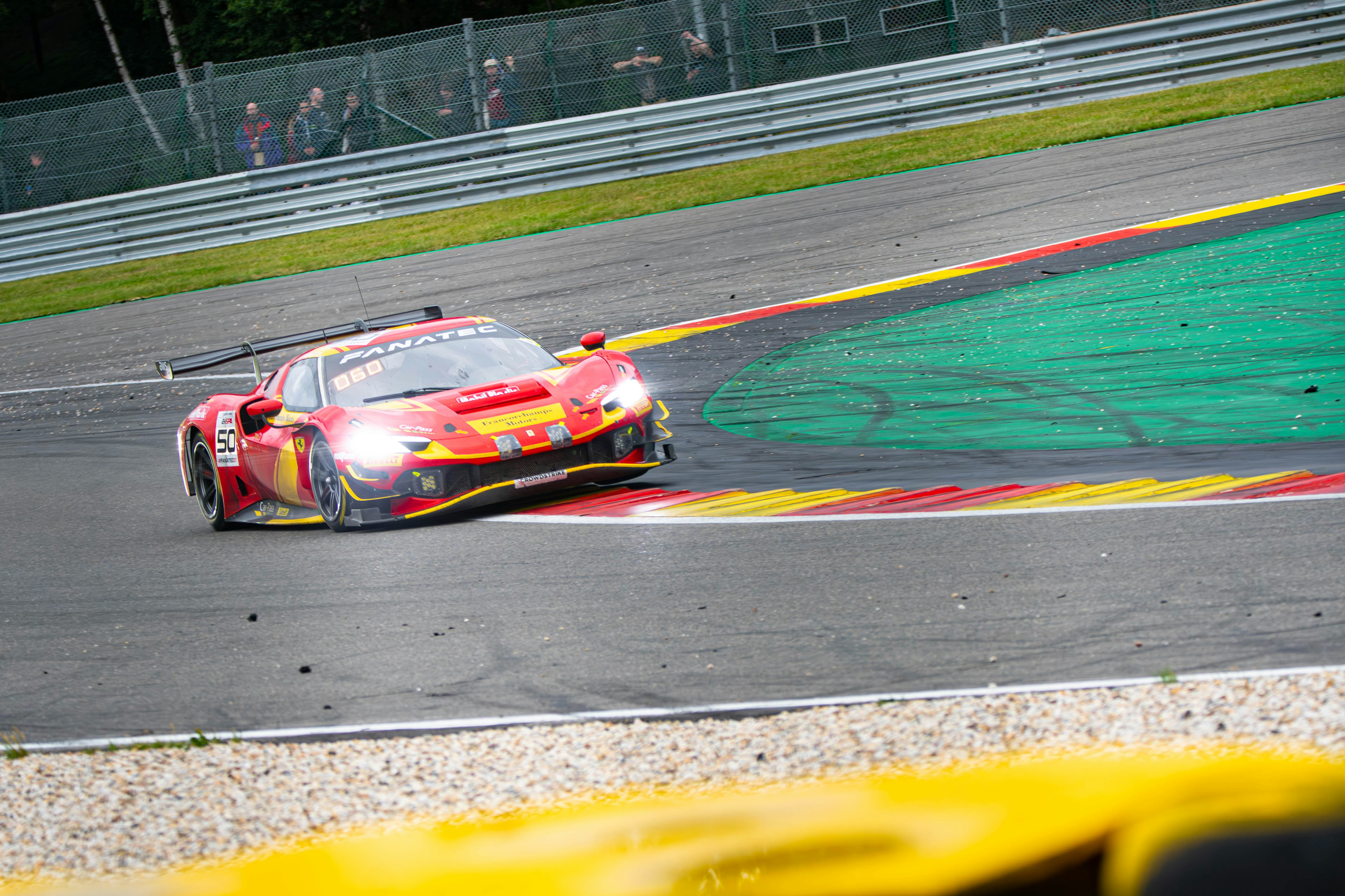 A red sports car driving on a race track photo – Free Ferrari race ...