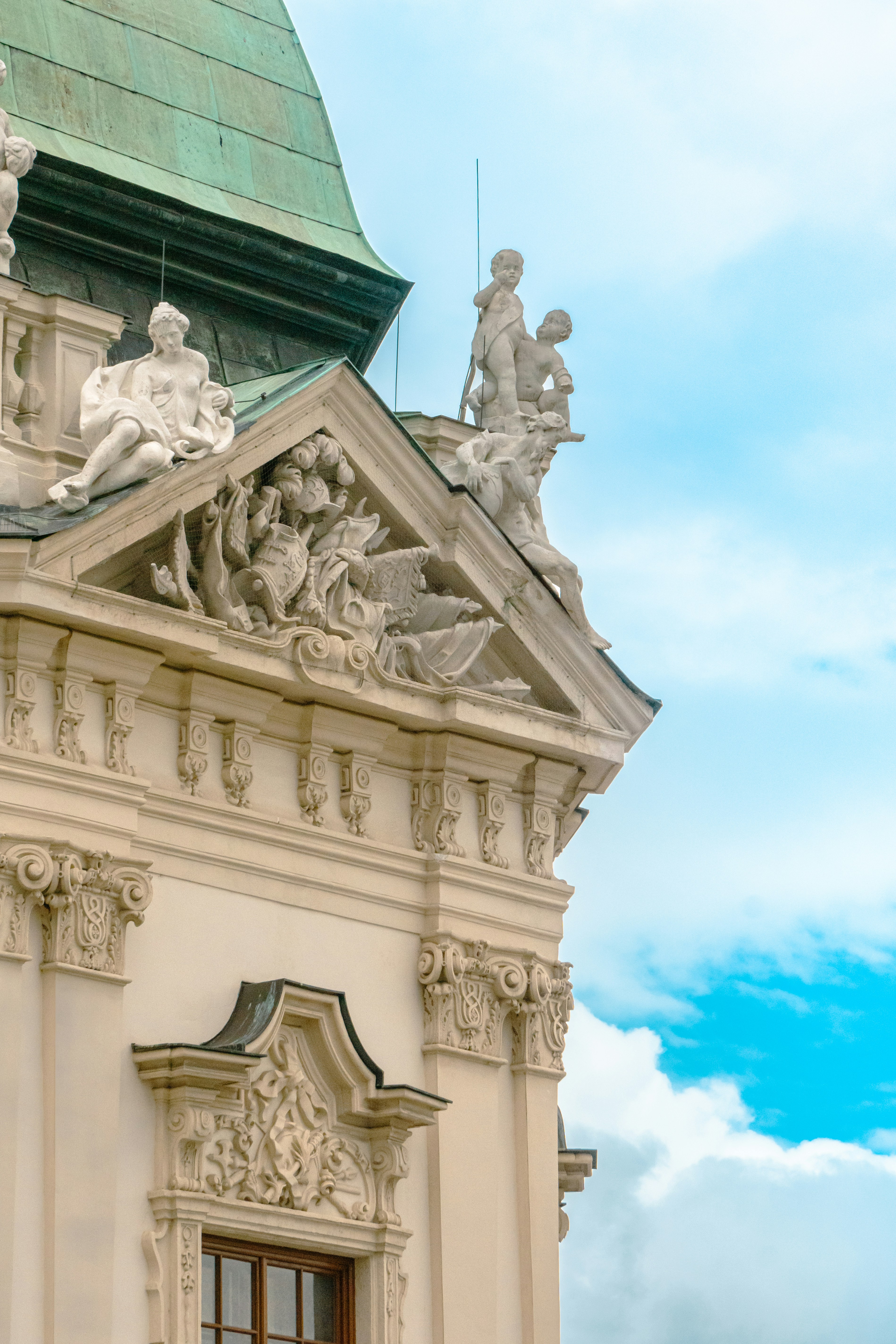 A tall building with statues on top of it photo – Free Wien Image on ...