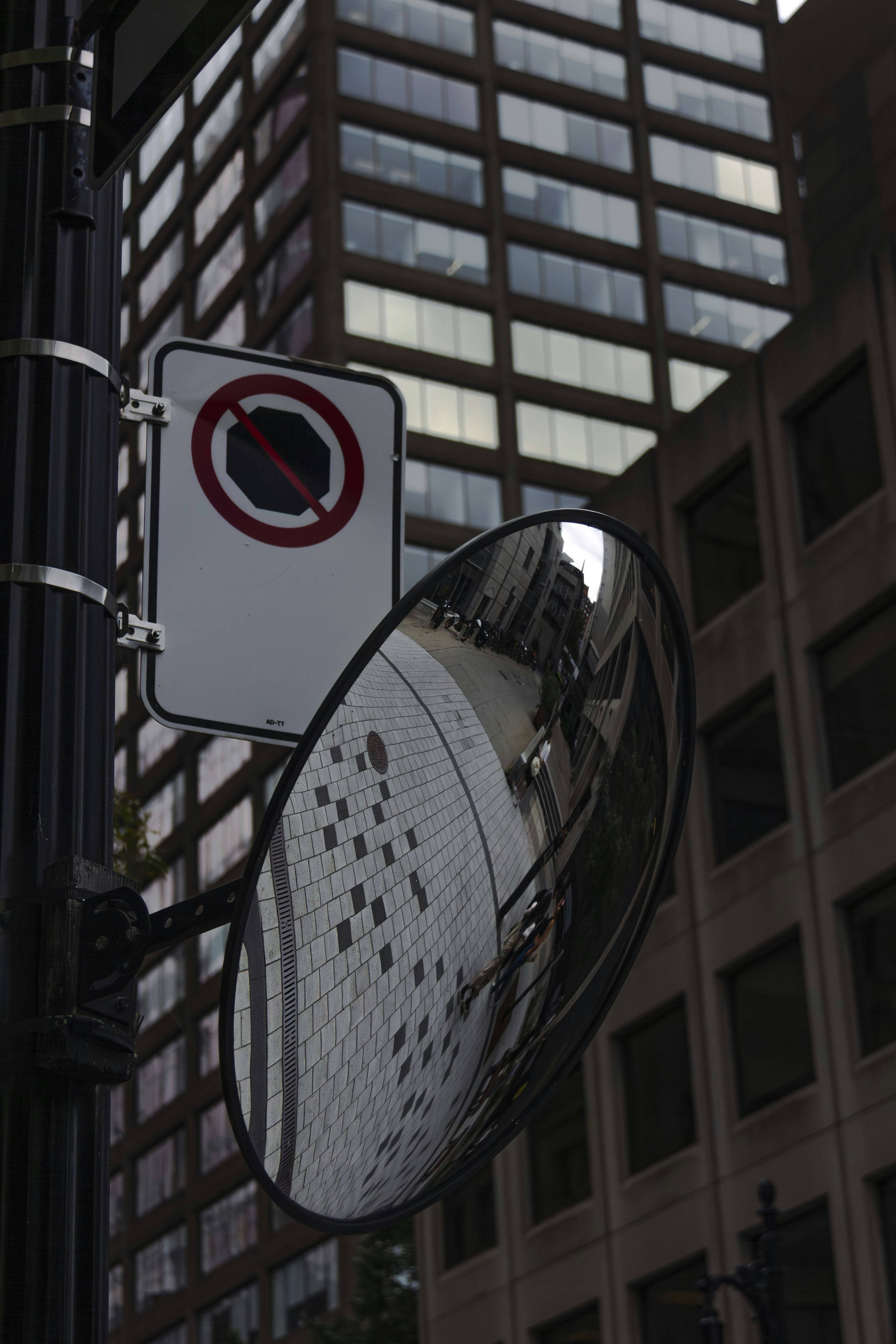 Chrome Cyclops Over the City Block: Reflections in a Street Mirror