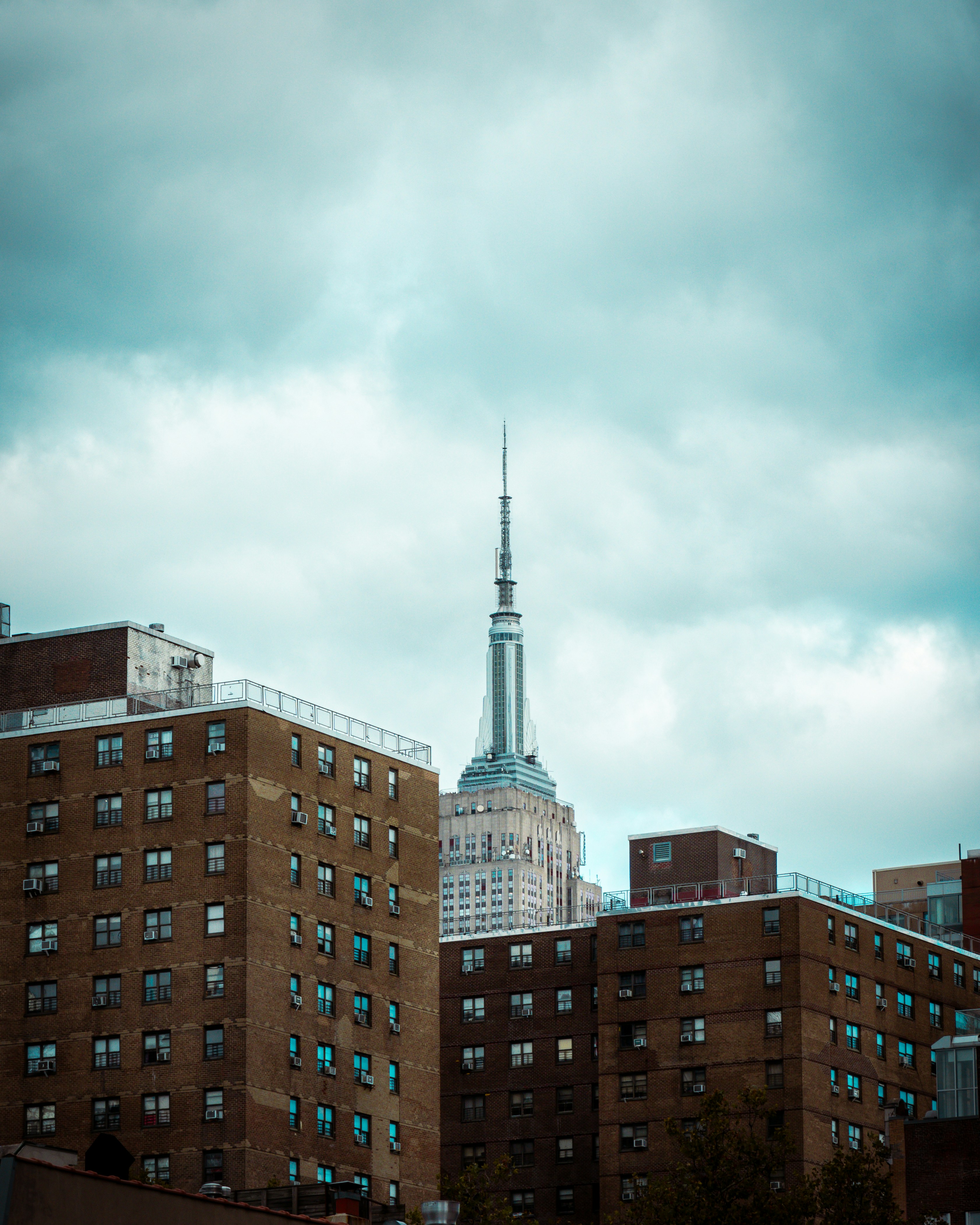 A tall building with a spire on top of it photo – Free New york Image ...