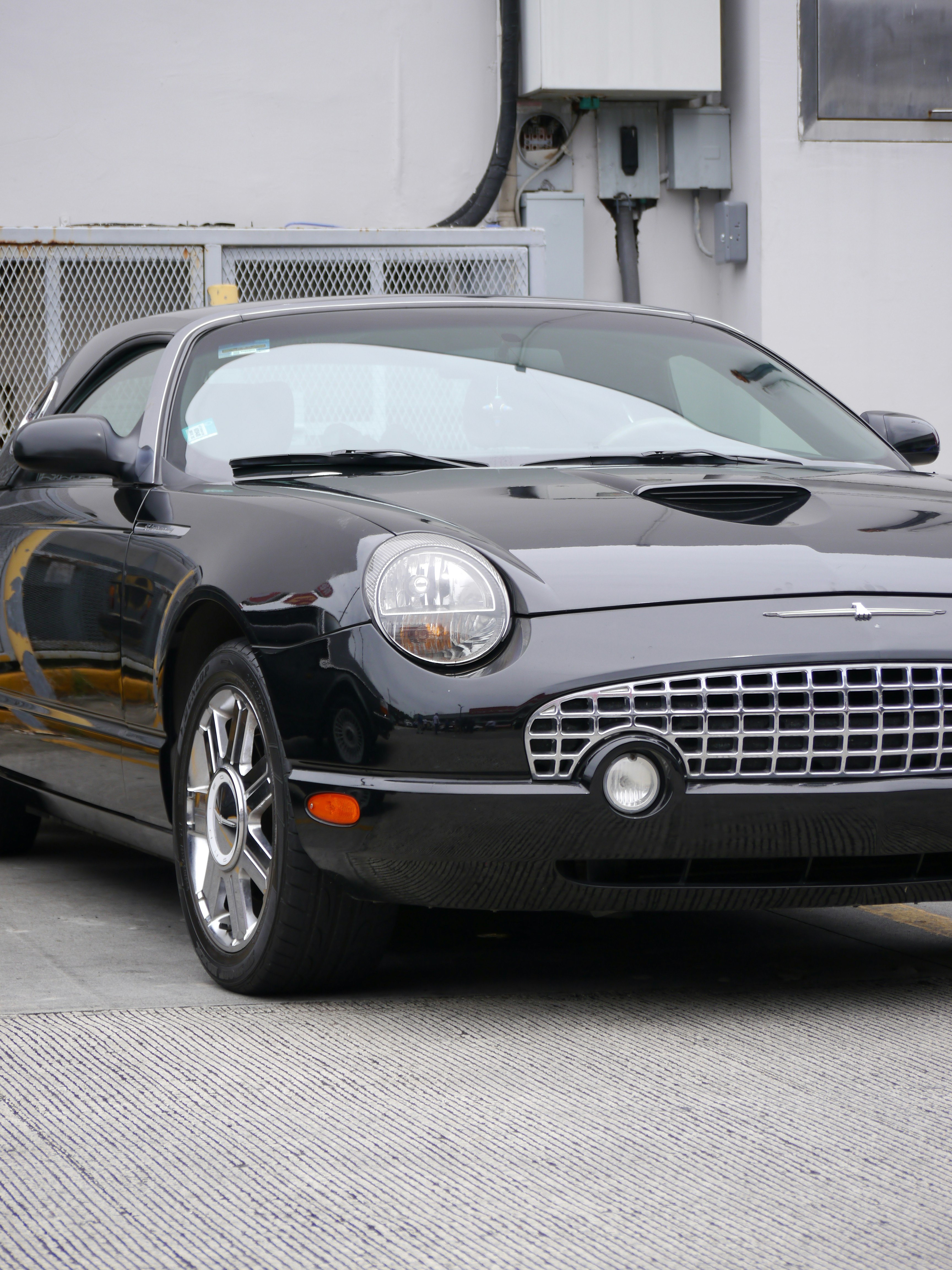 Midnight Chrome: Front-Grille Portrait of a Vintage Sports Car