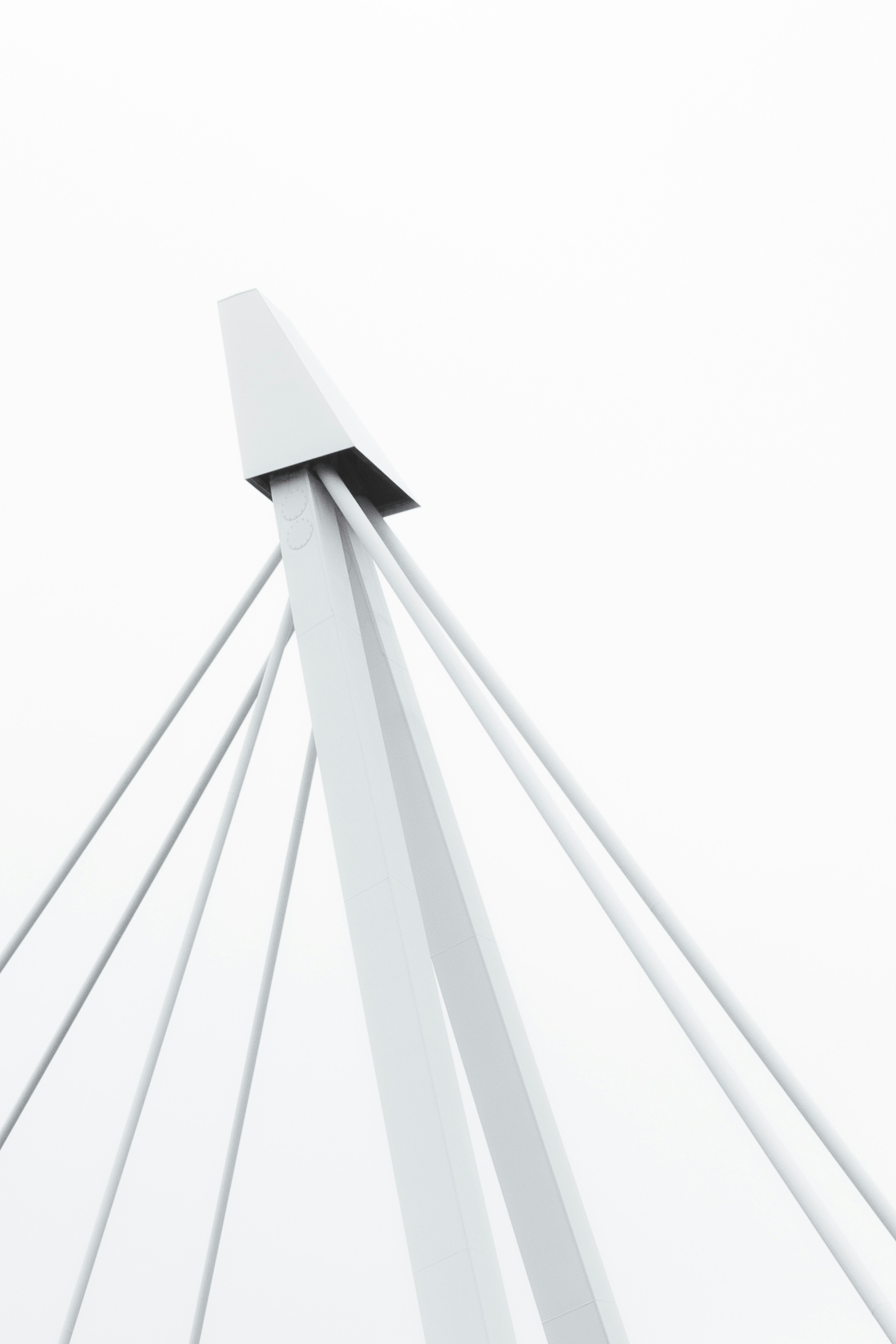 Brigde pylon high key | a close up of the top of a white bridge