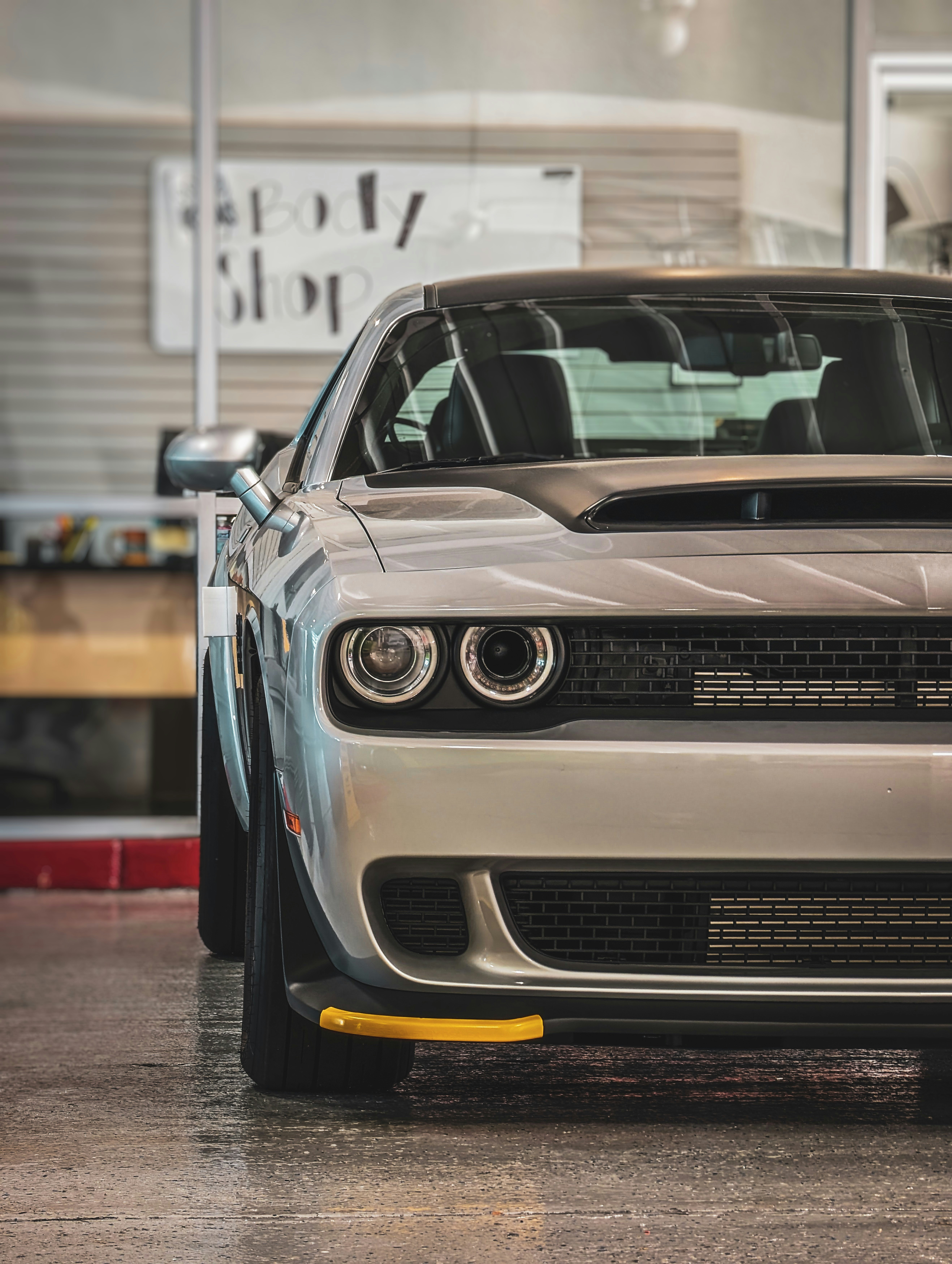 The front end of a car in a garage photo – Free Car Image on Unsplash