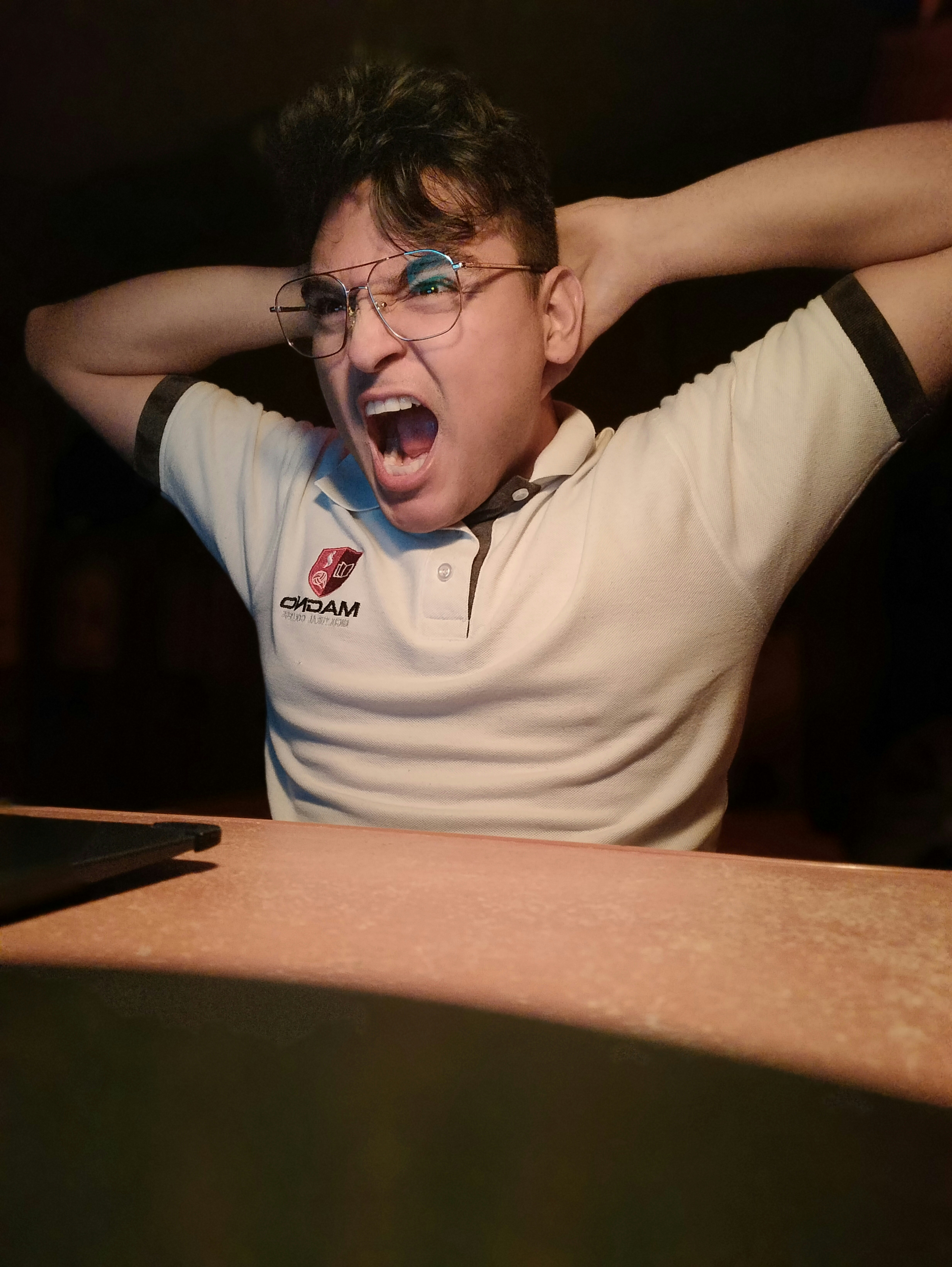 Frantic Expression at the Desk: A Candid Moment