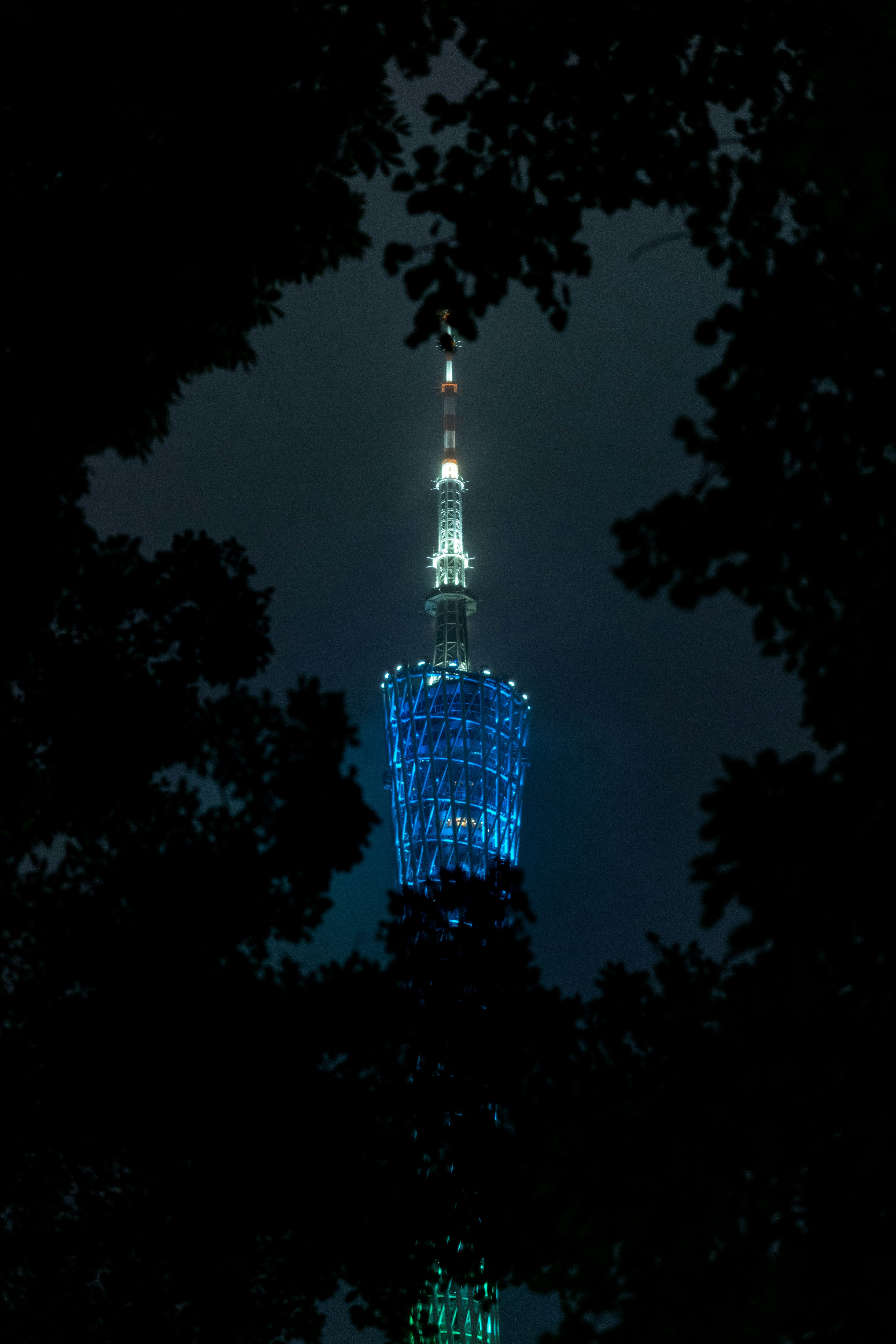 The top of a building lit up at night photo – Free Guangzhou Image on ...