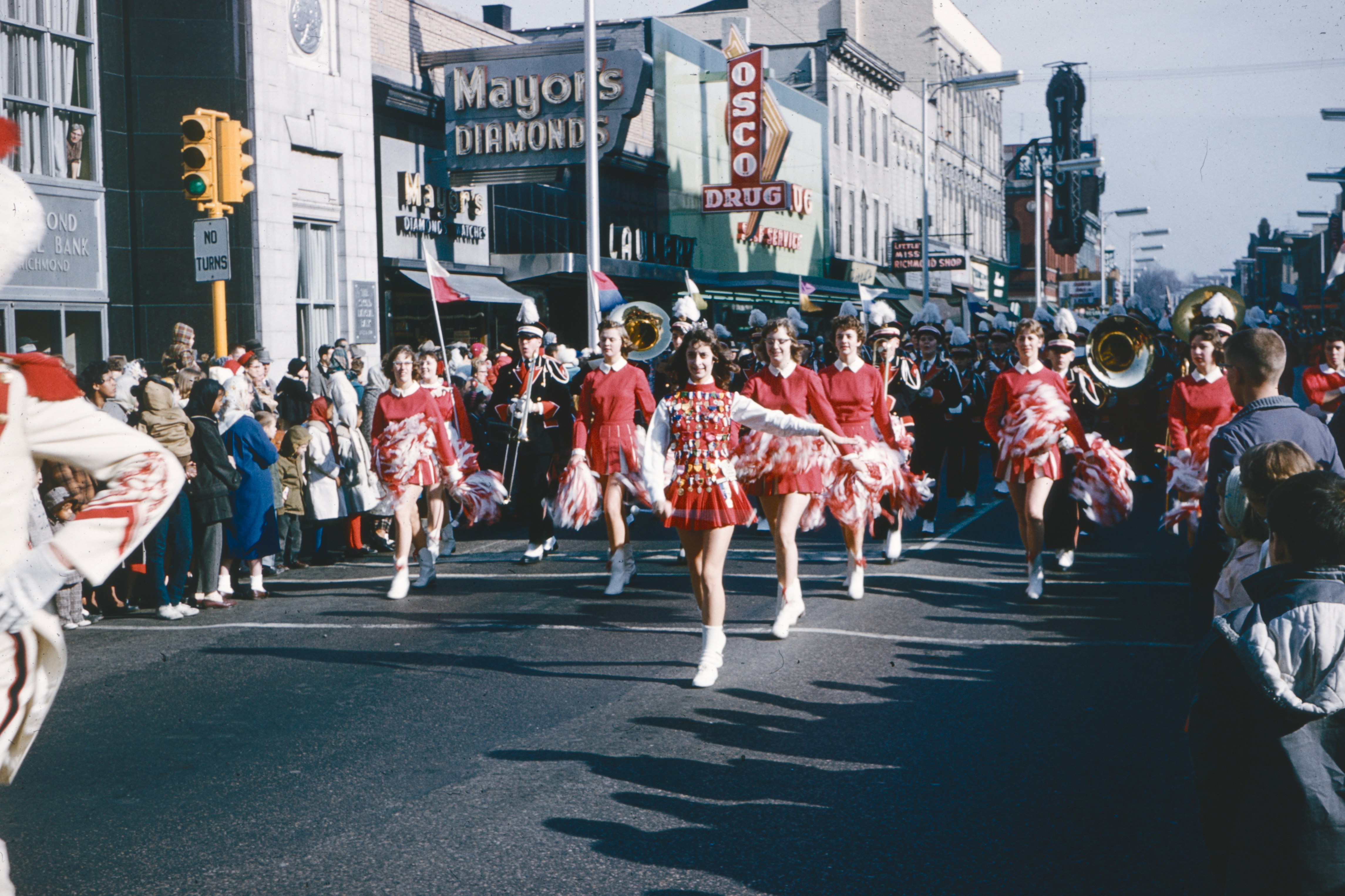 A group of people that are standing in the street photo – Free Parade ...