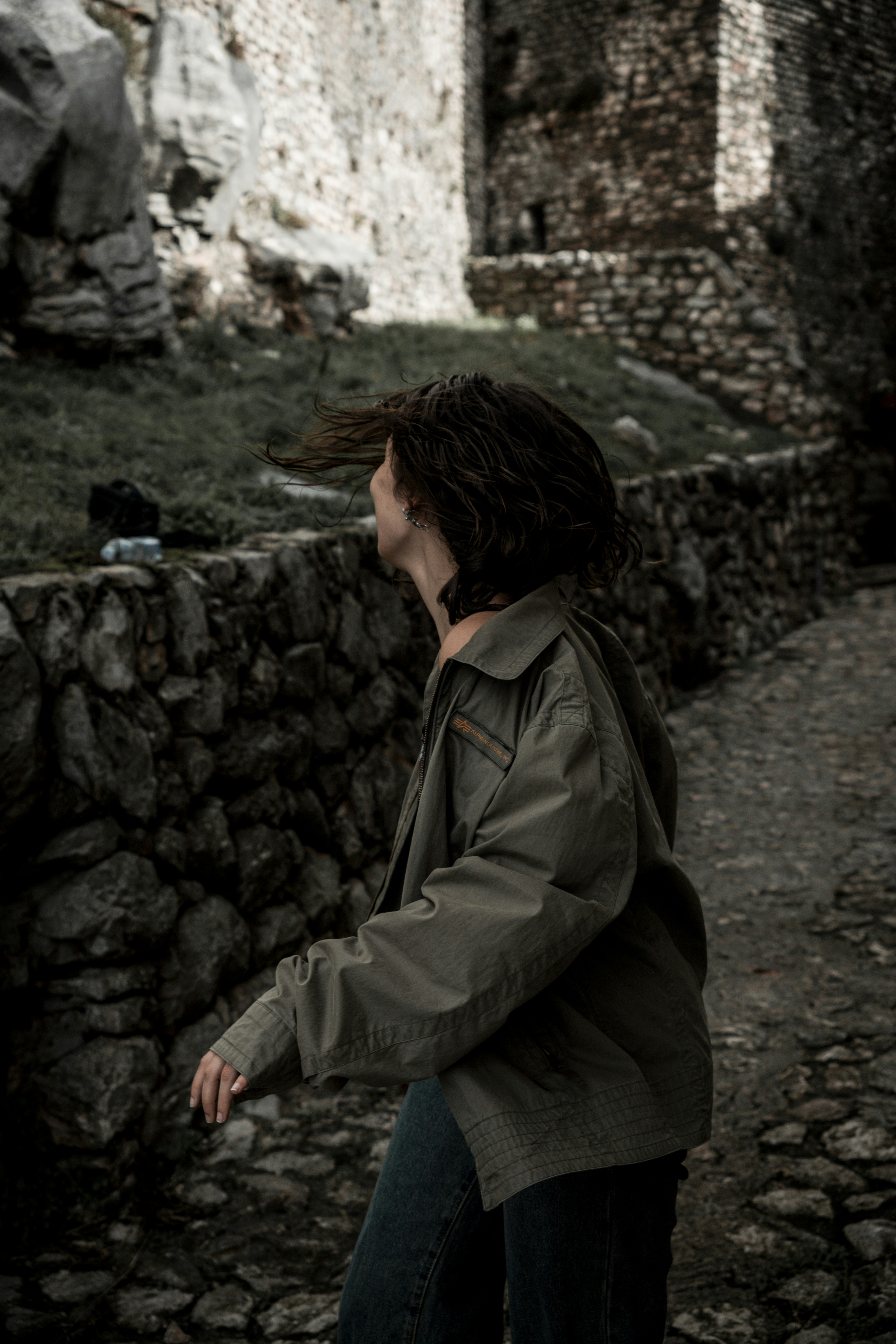 Turned Away: A Moment of Gale-Driven Escape Along An Ancient Wall