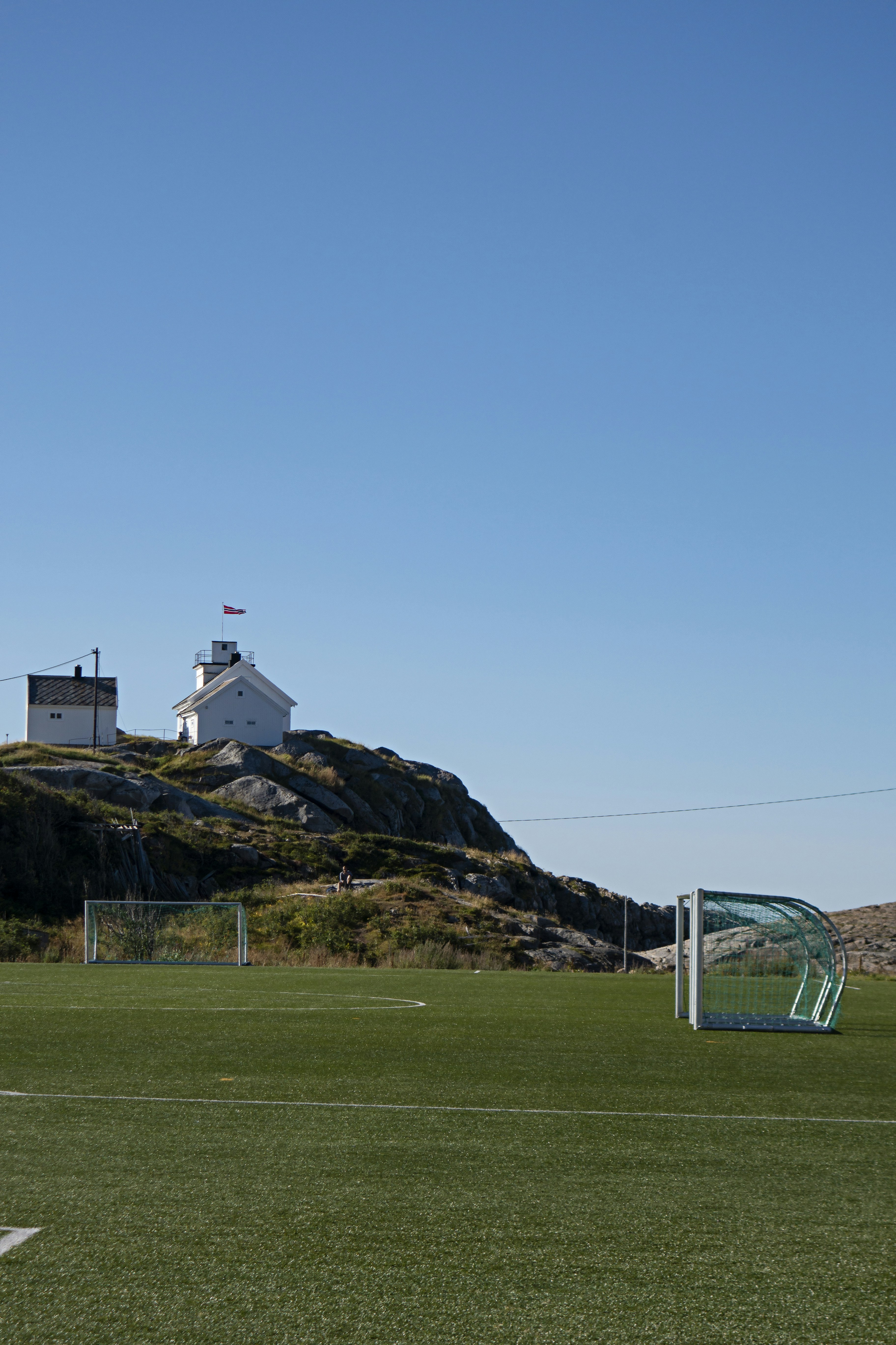Hilltop White House Framing a Seaside Soccer Field