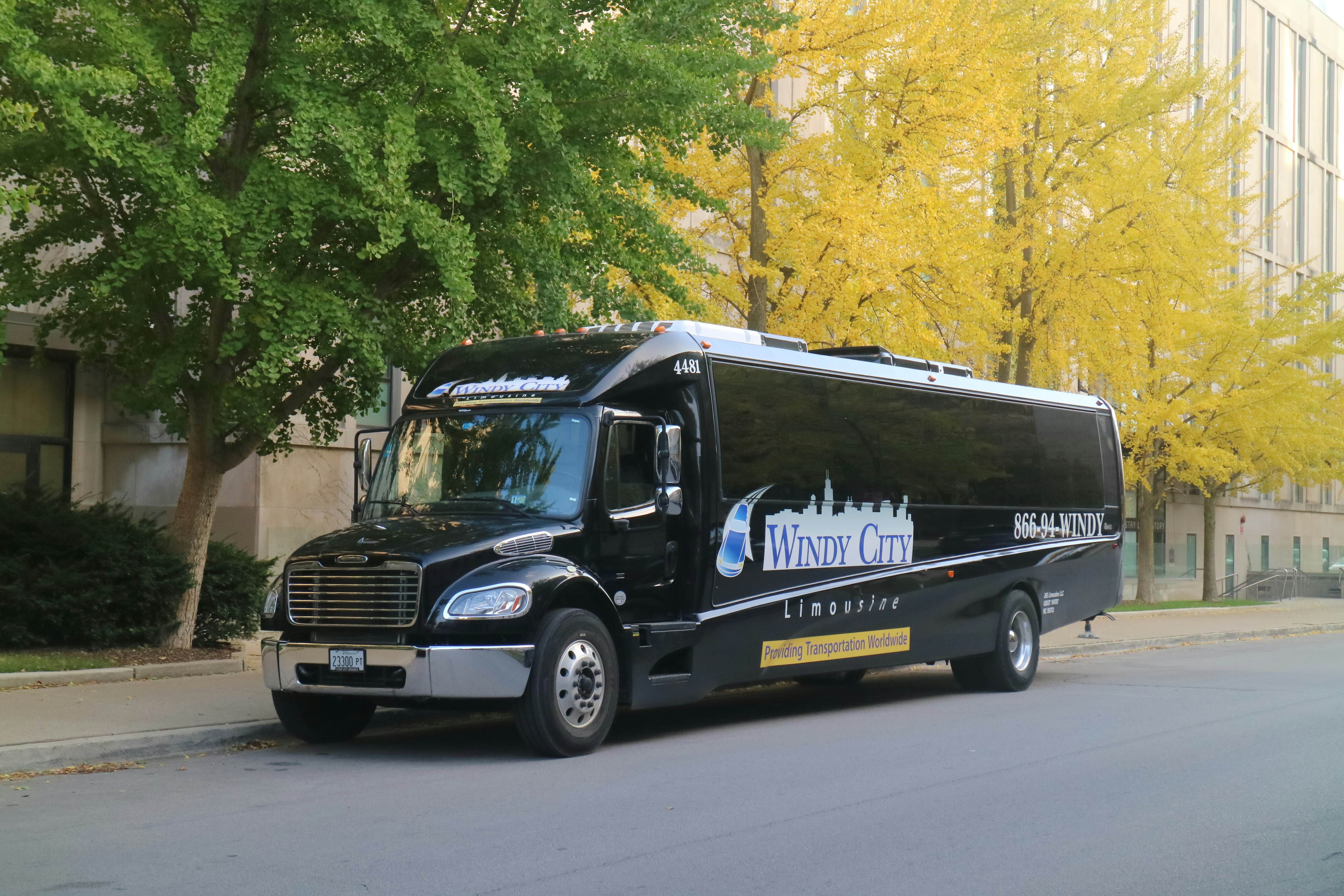 A tour bus parked on the side of the road photo – Free Chicago Image on ...