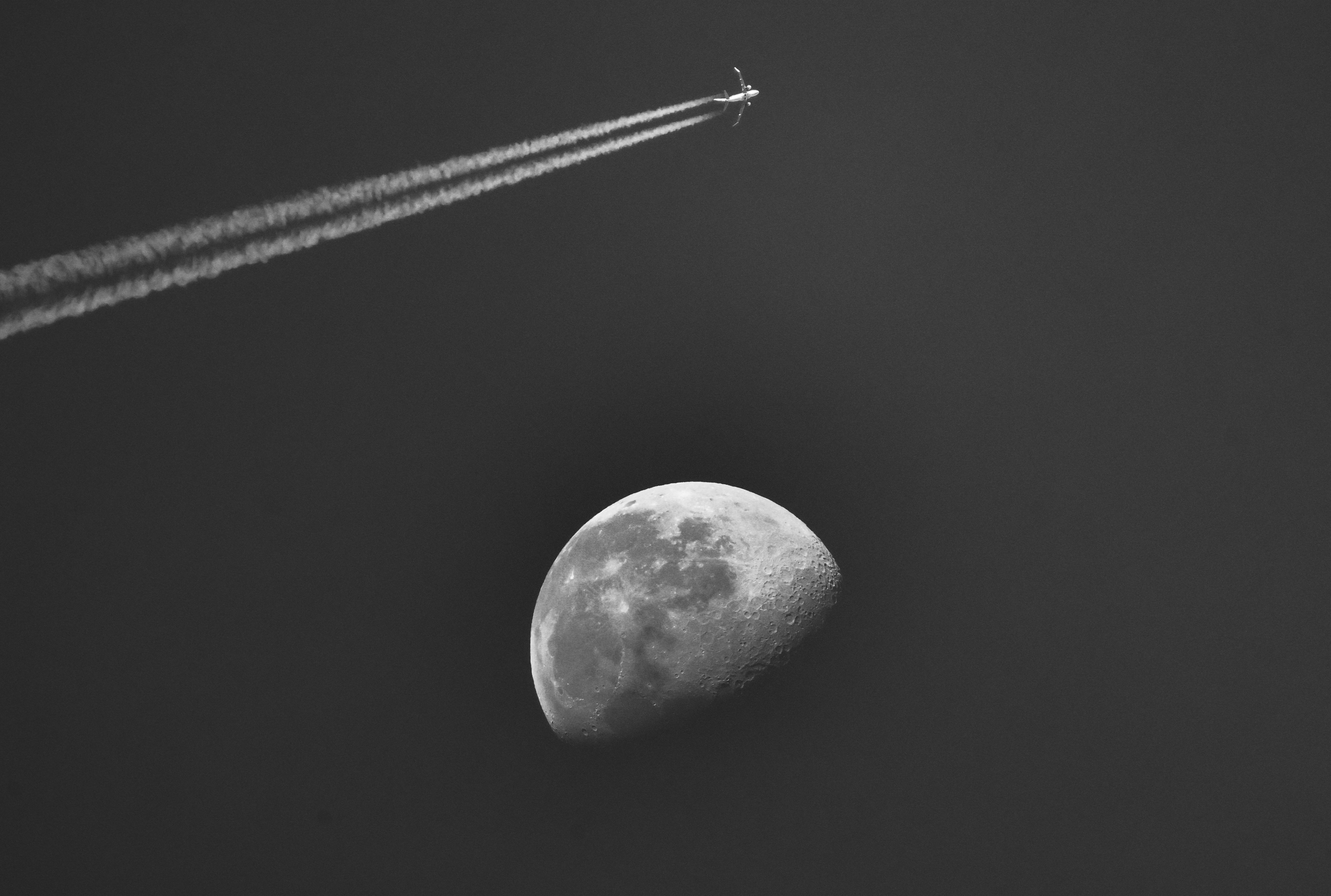 Moonlit Monochrome: Jet Trails Across a Quiet Sky