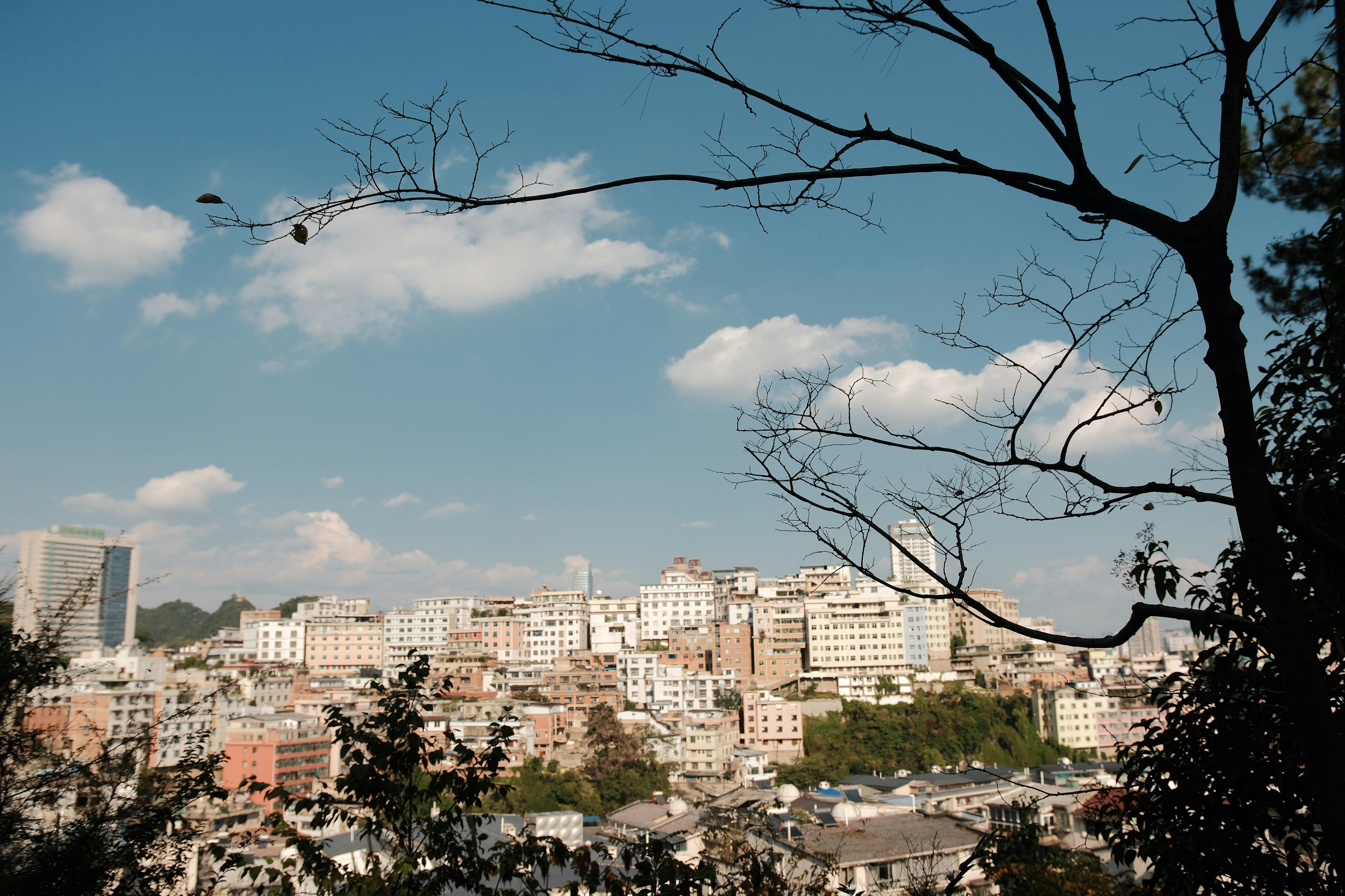 a view of a city from the top of a hill