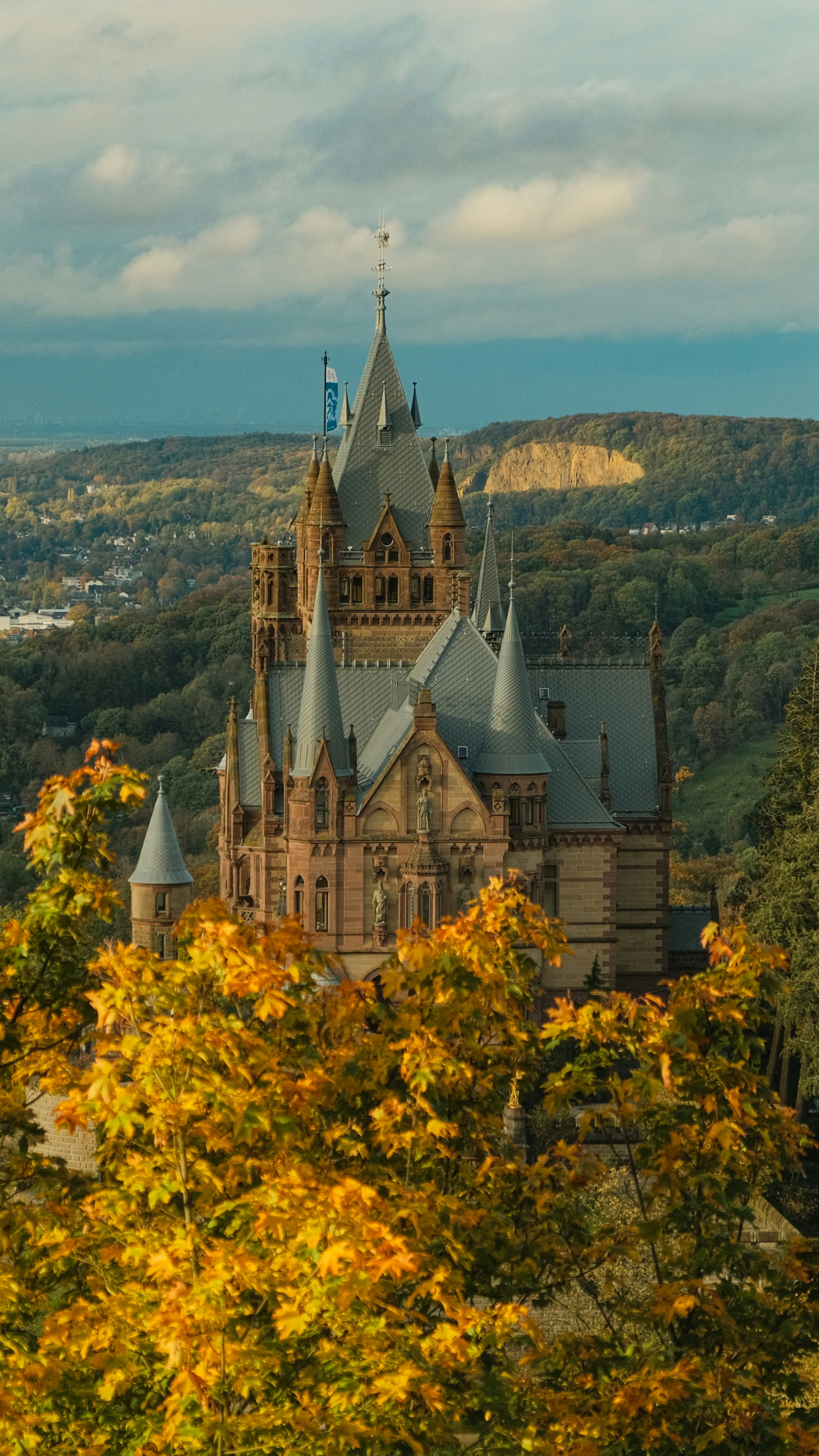 Castle Spires in Autumn's Golden Veil