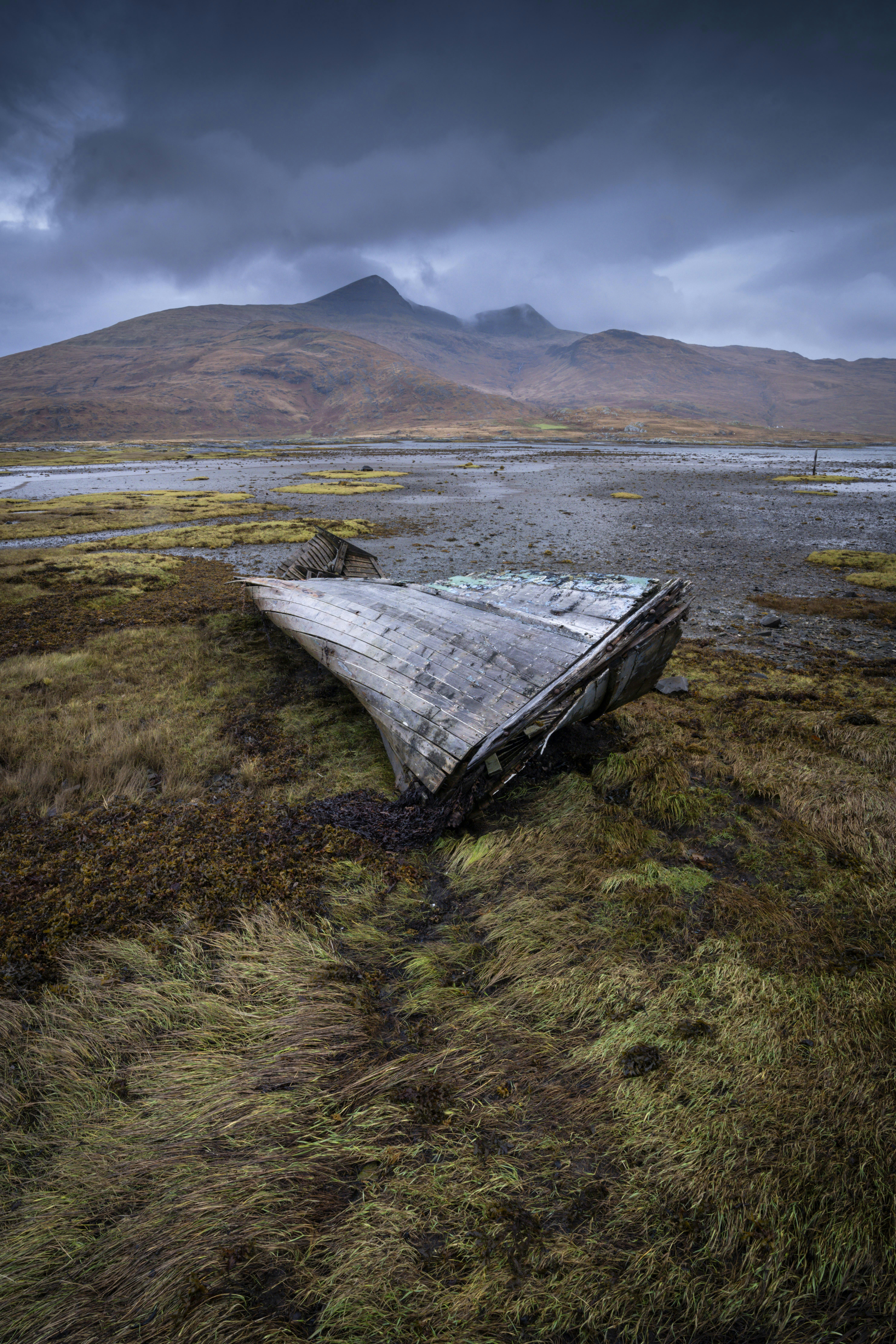 Ruined Boat in a Highland Basin Under Stormy Skies