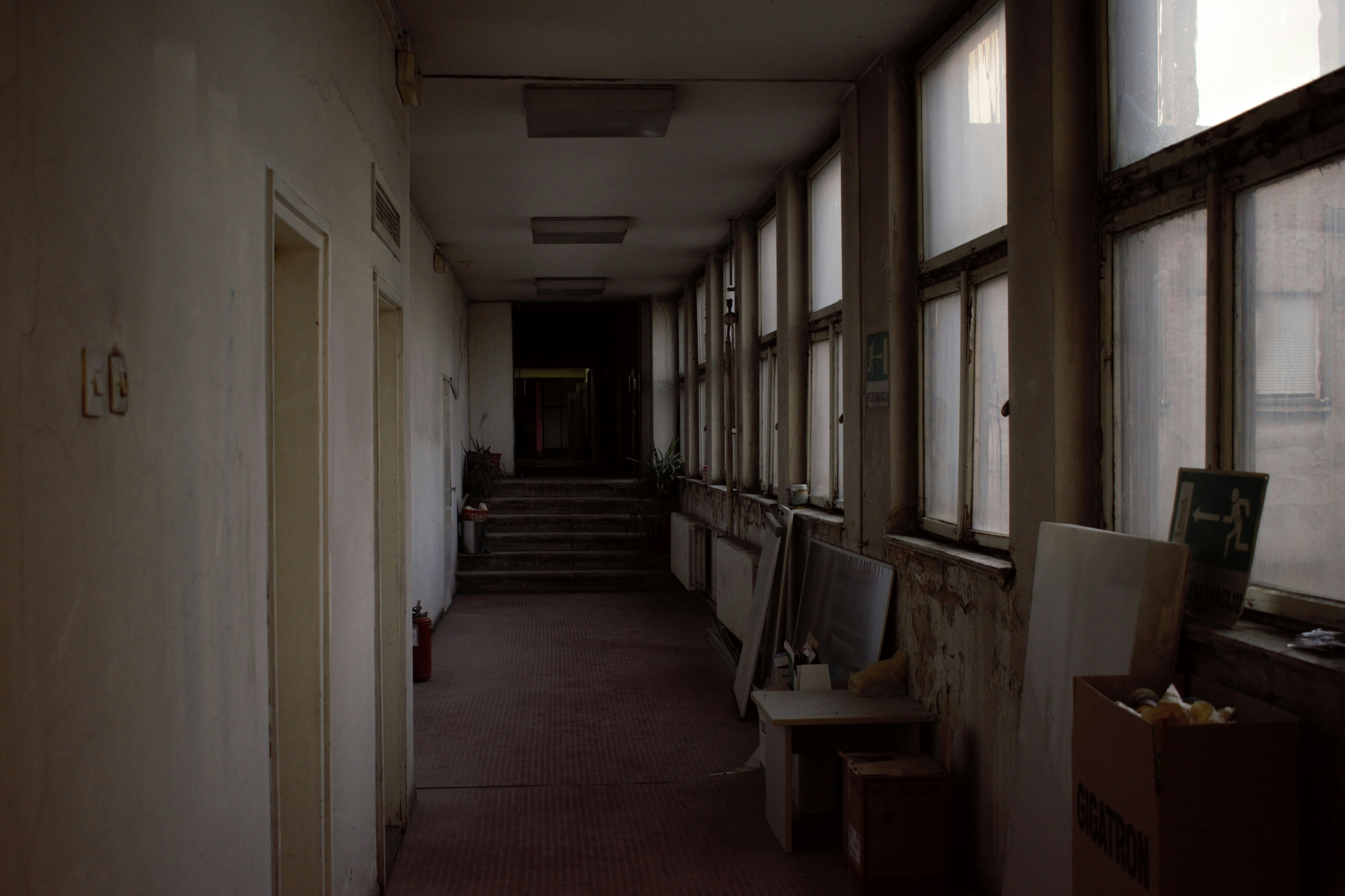 A long hallway with a bunch of windows photo – Free Building Image on ...