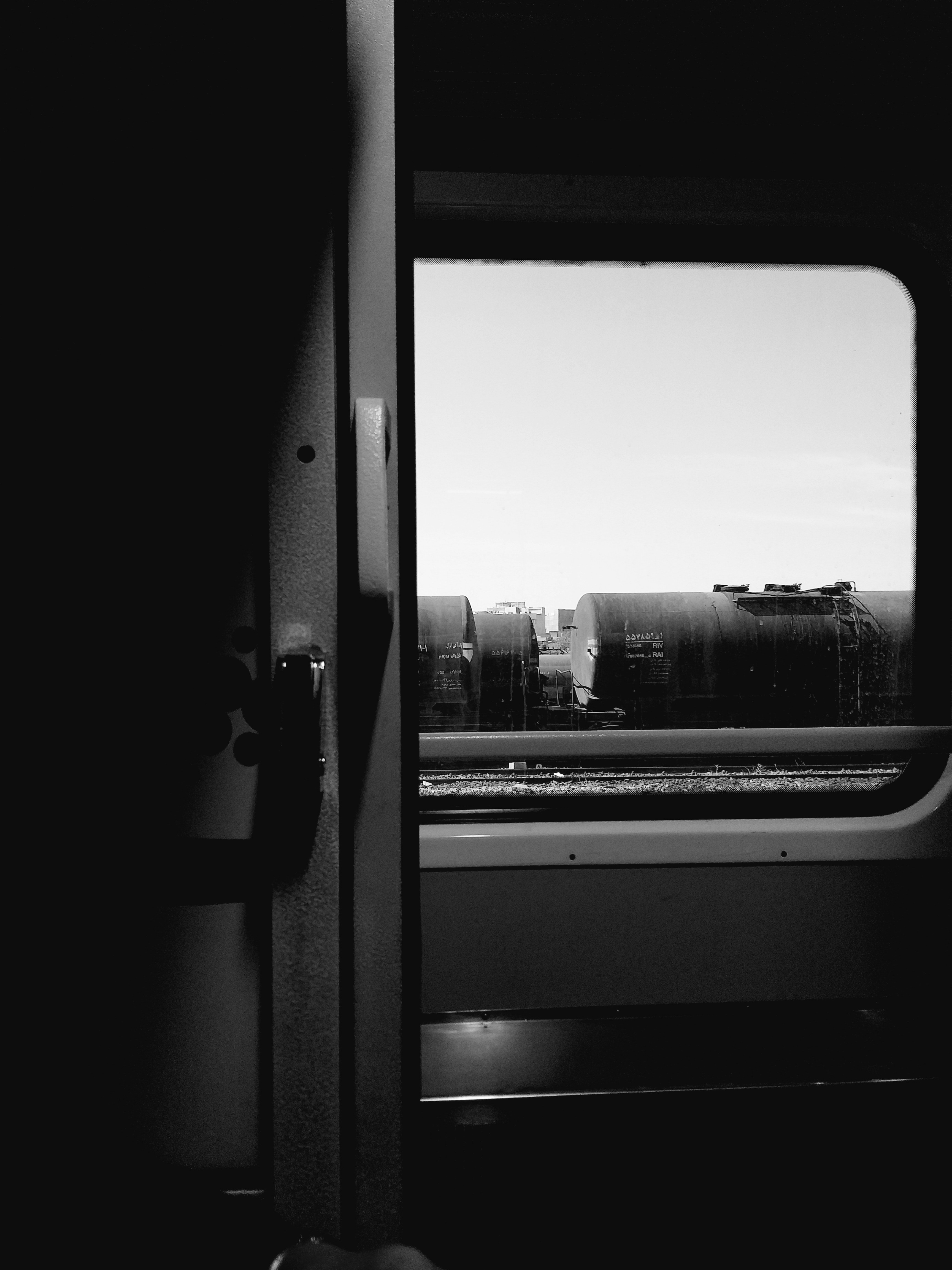 A black and white photo of a train window photo – Free Blue Image on ...