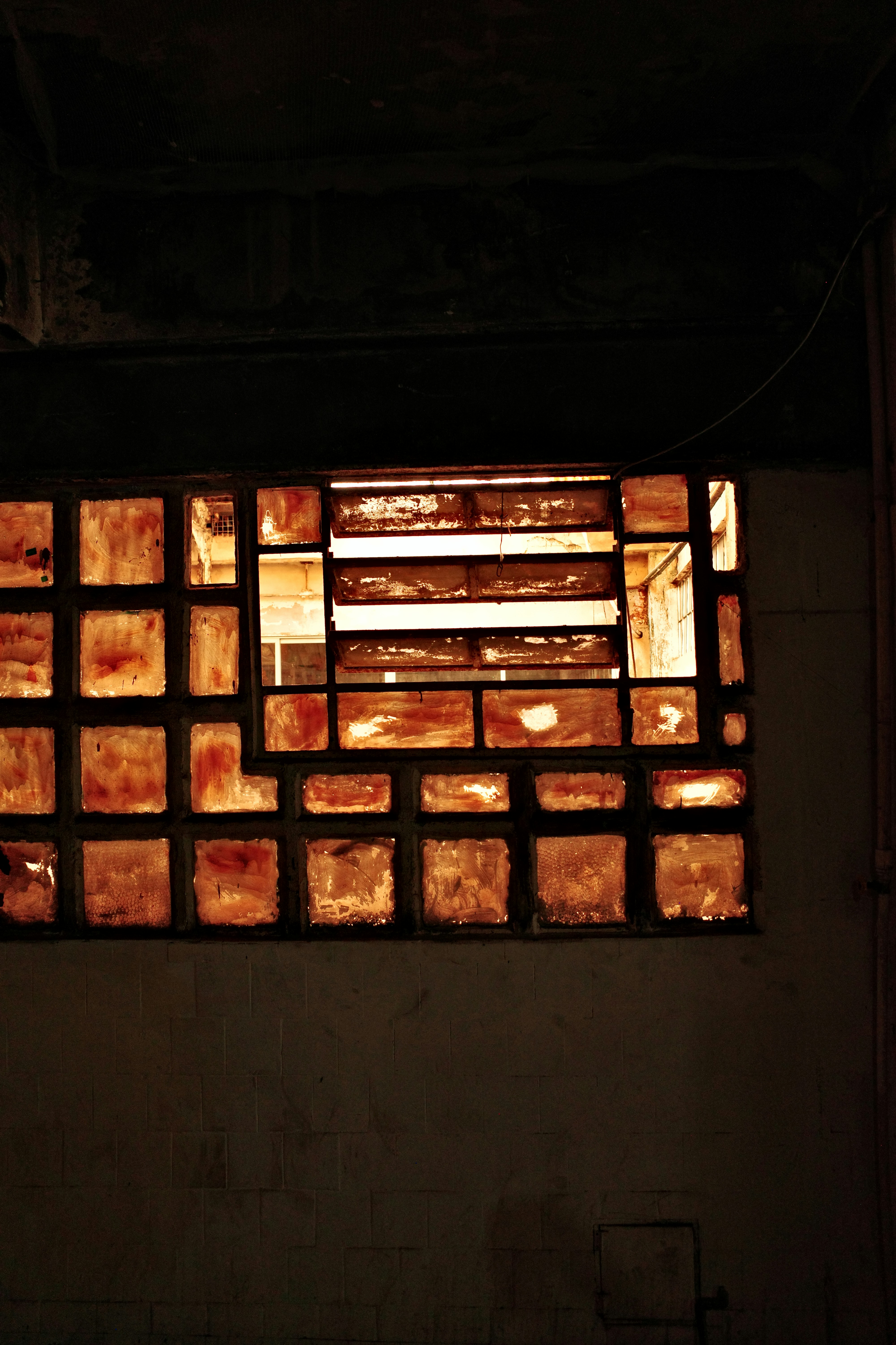 A window in a building that has a bunch of bricks in it photo – Free ...