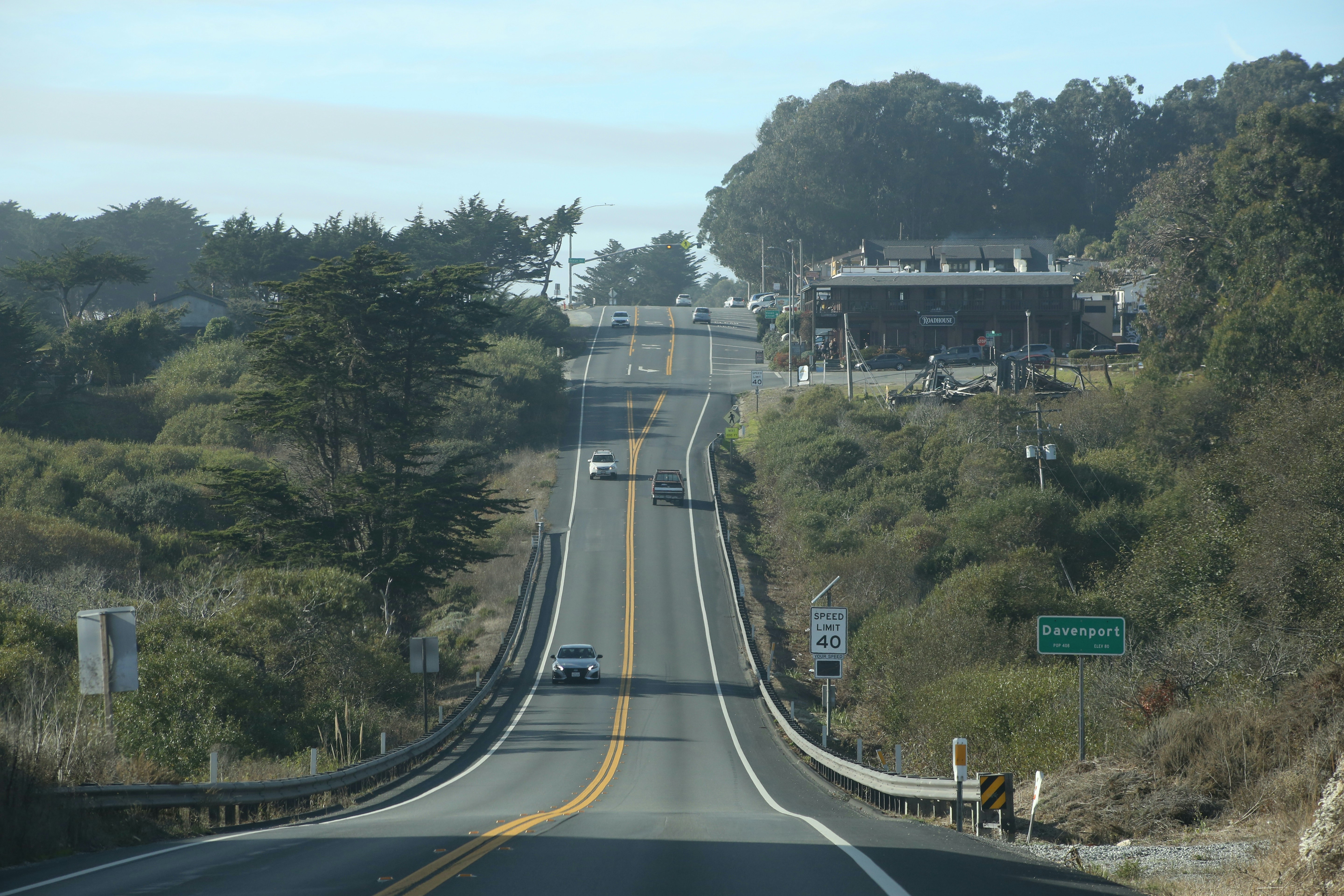 Horizonbound: A Coastal Road Vanishing Toward a Quiet Town