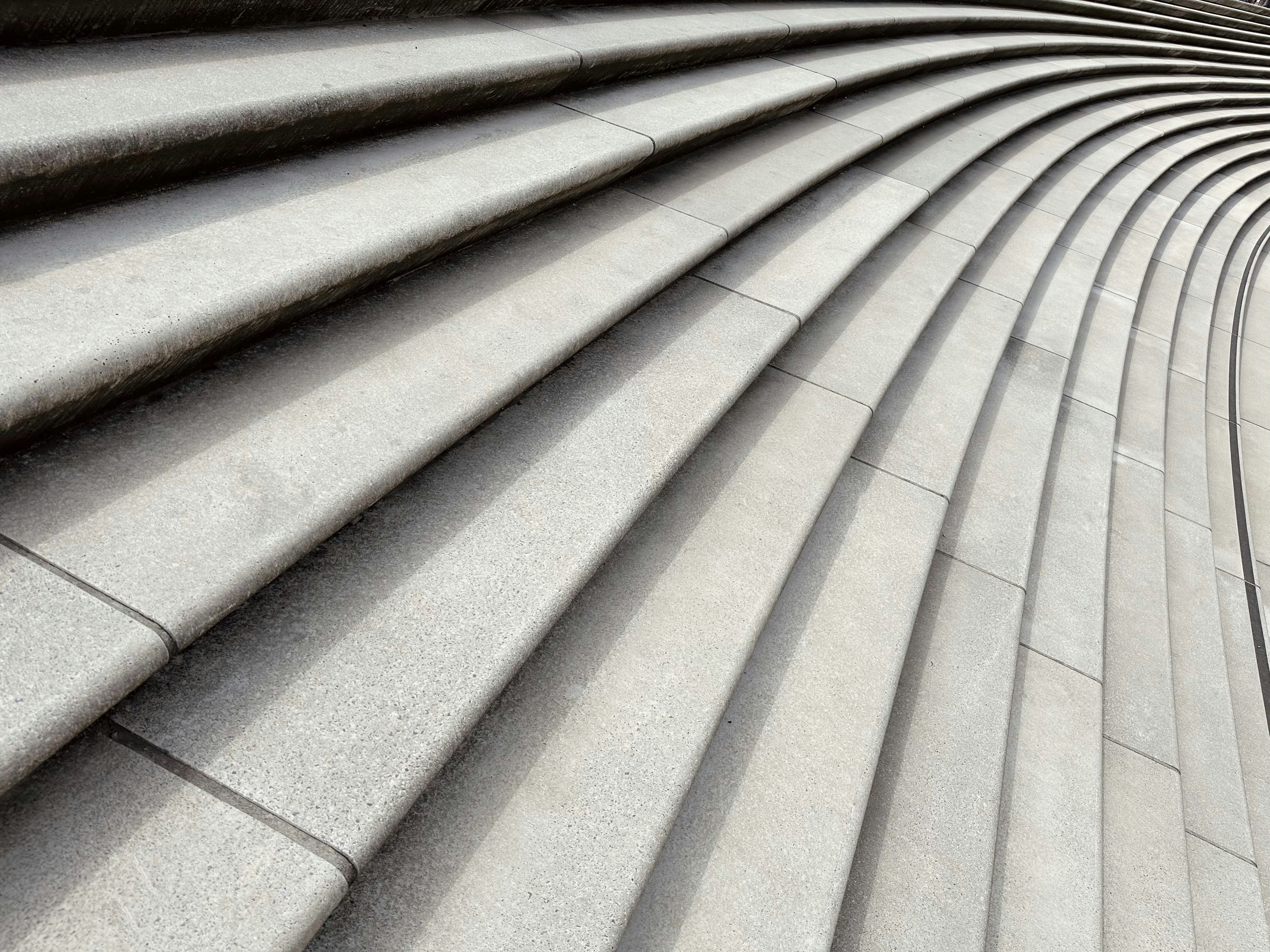 A close up view of a curved concrete structure photo – Free Grey Image ...