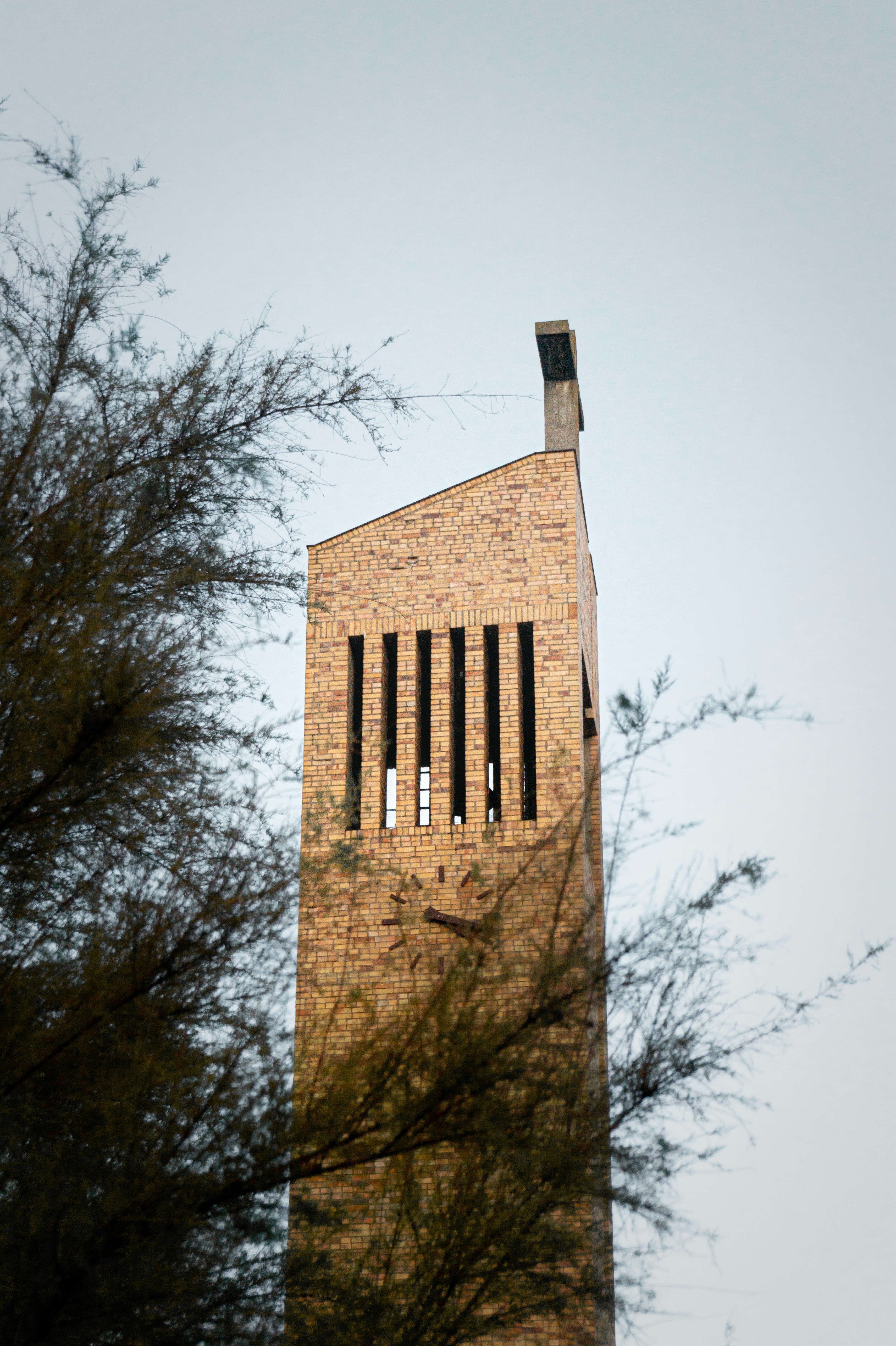 Brick Bell-Tower Rising Against a Clear Sky