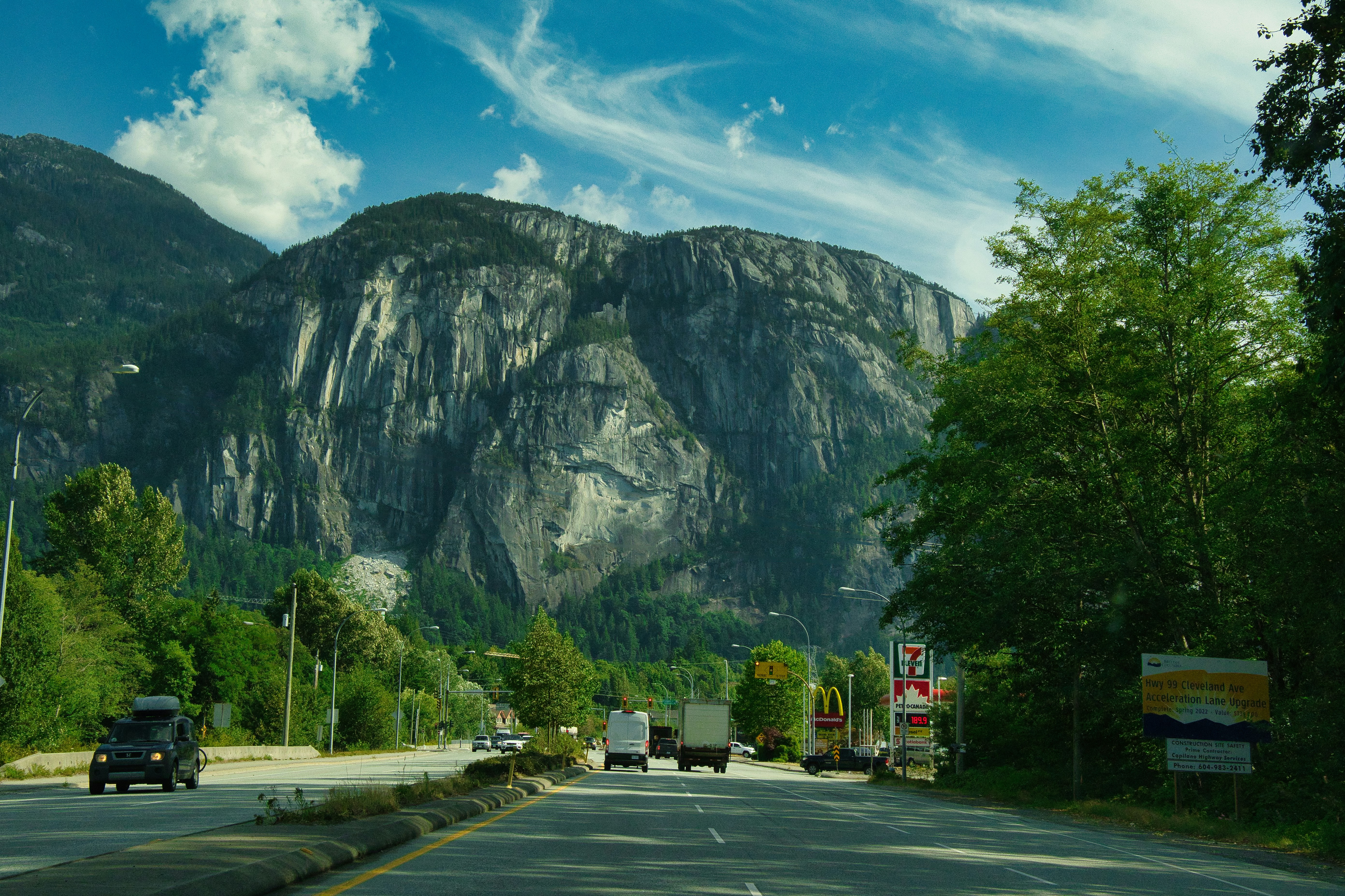 Mountainsline: Highway Through a Valley Under a Clear Sky