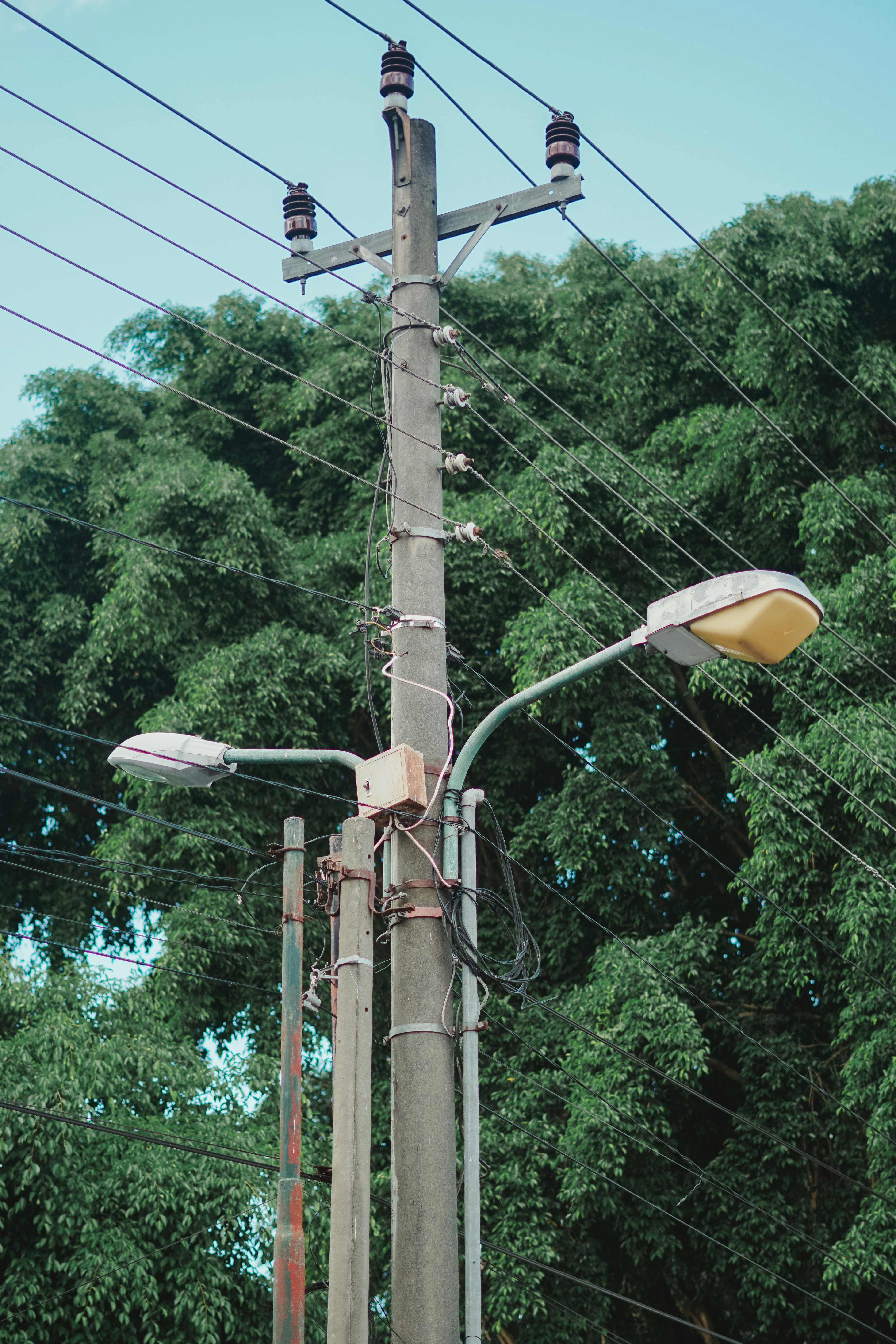 A pole with a street light and some power lines photo – Free Travel ...