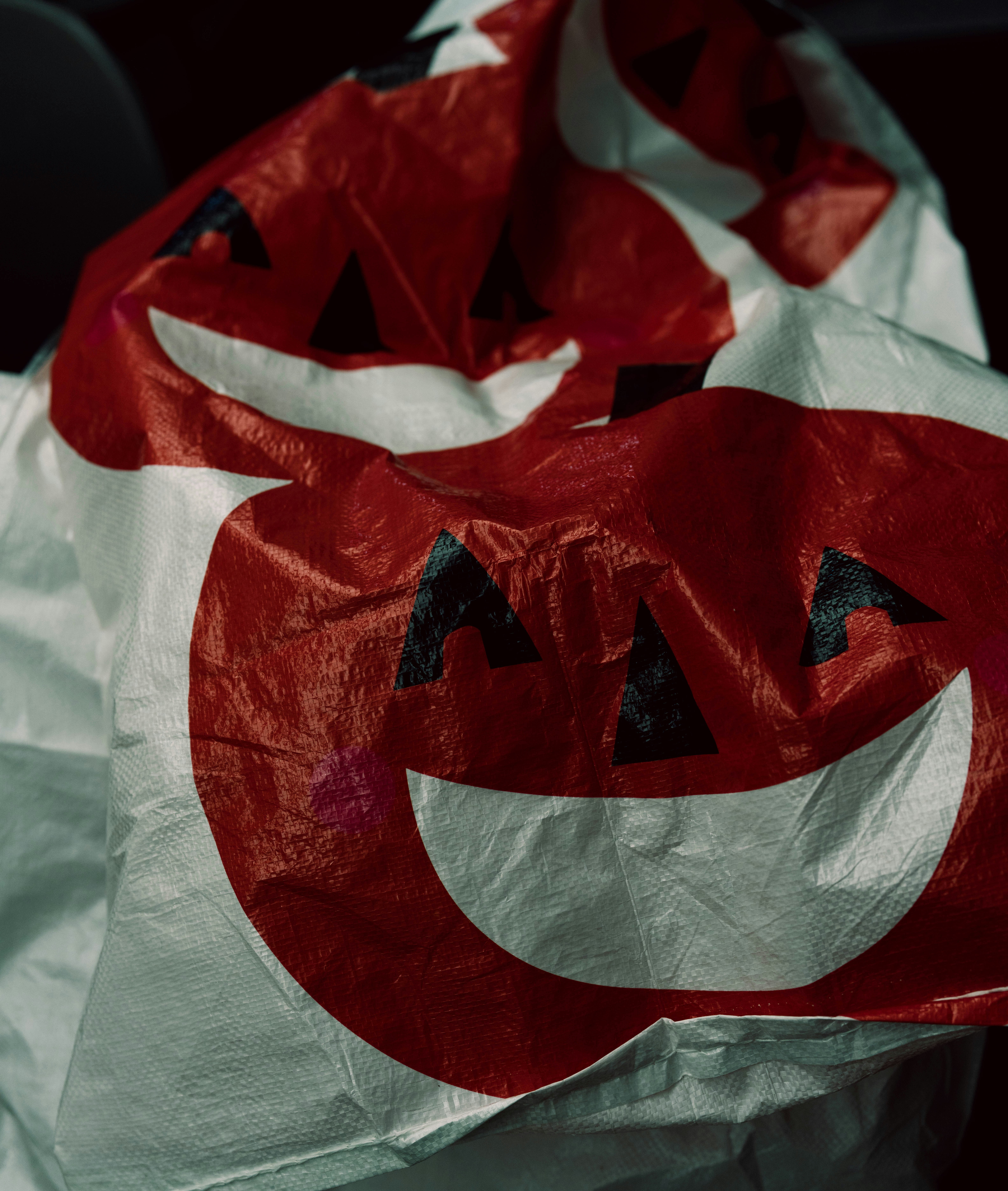 Crinkled Halloween Glow: Close-Up of a Jack-o’-Lantern Bag