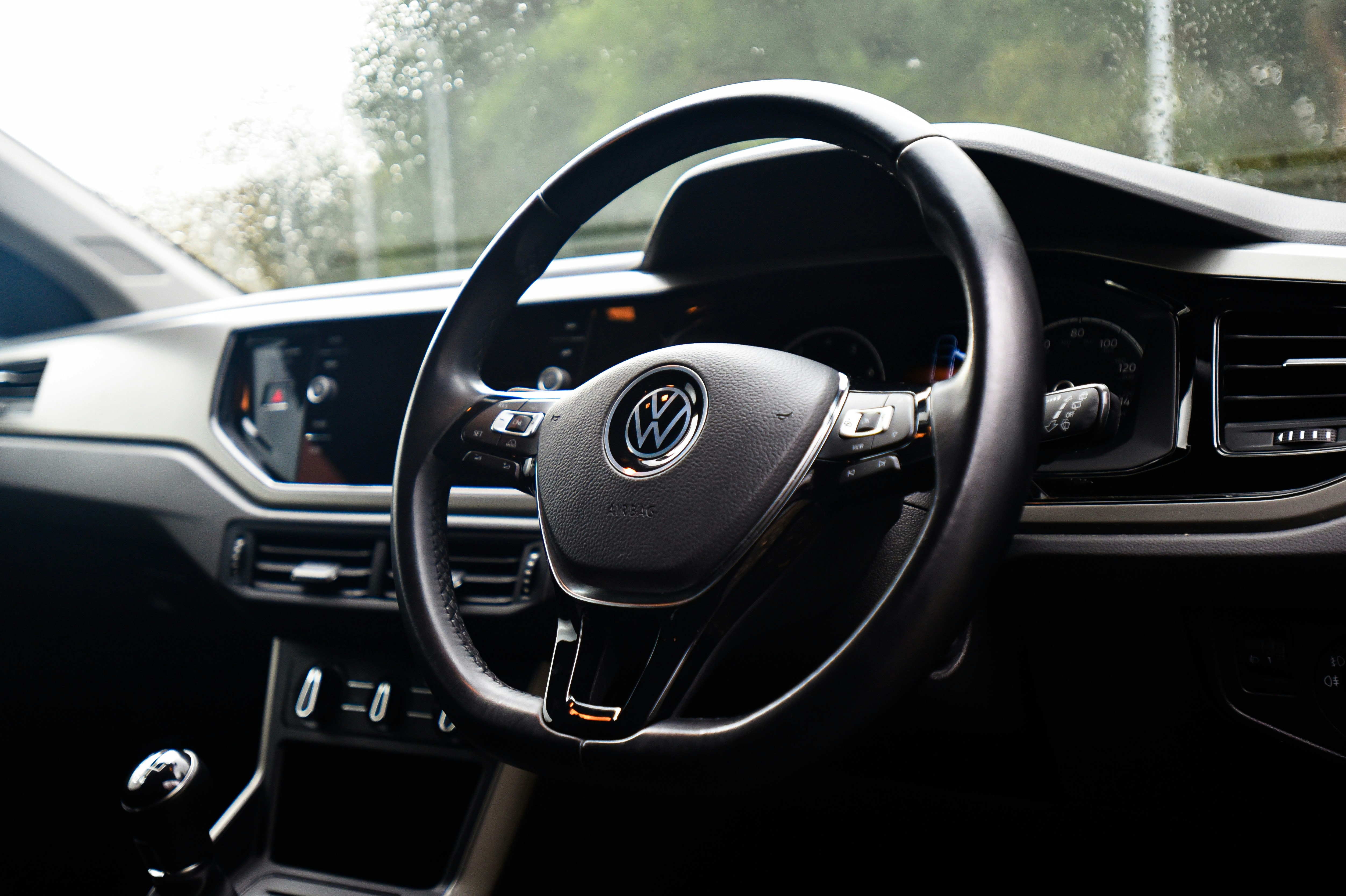 The interior of a car with a steering wheel and dashboard photo – Free ...