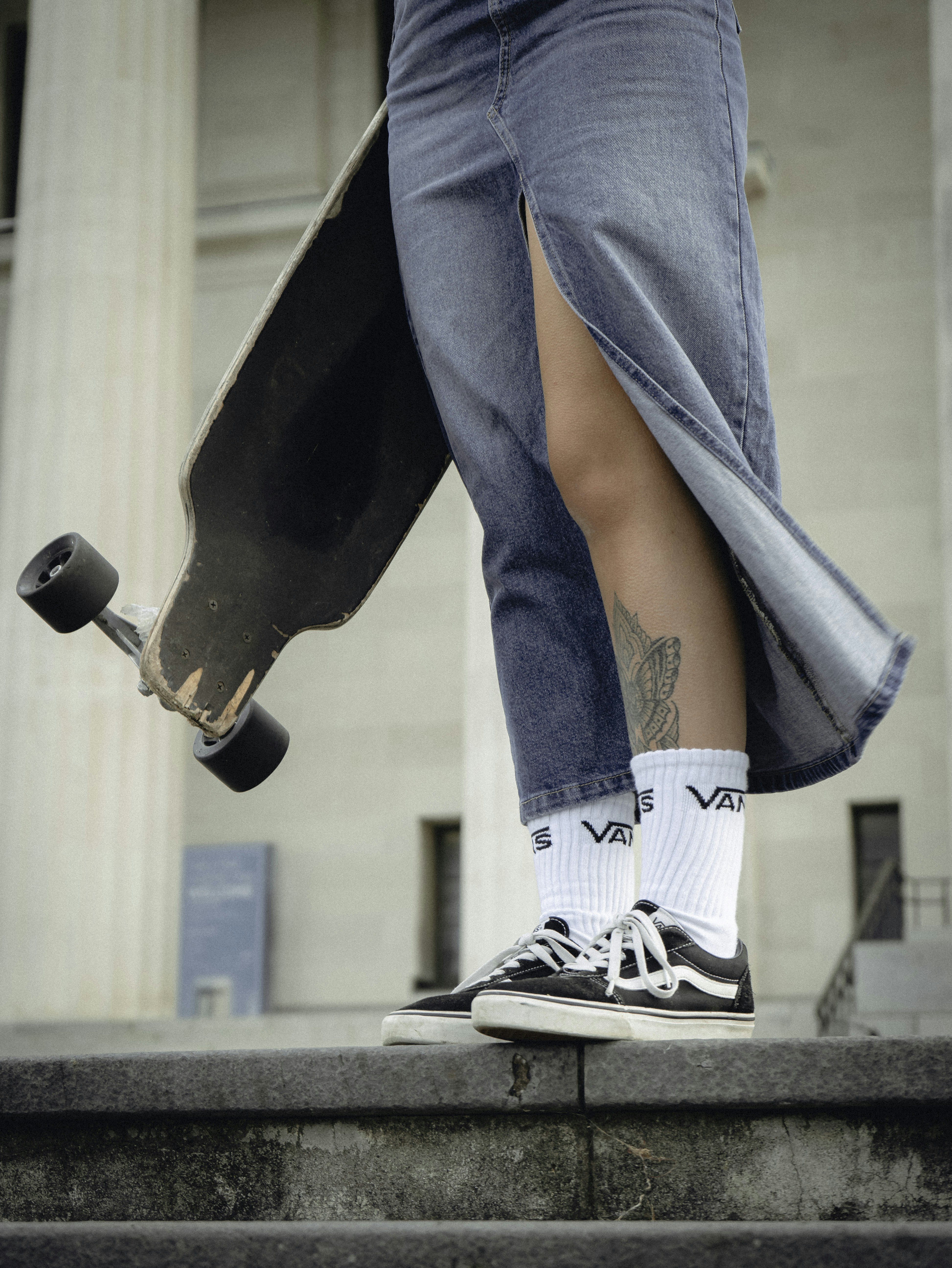 Stride and Board: A Low-Angle Moment with Sneakers and Skateboard