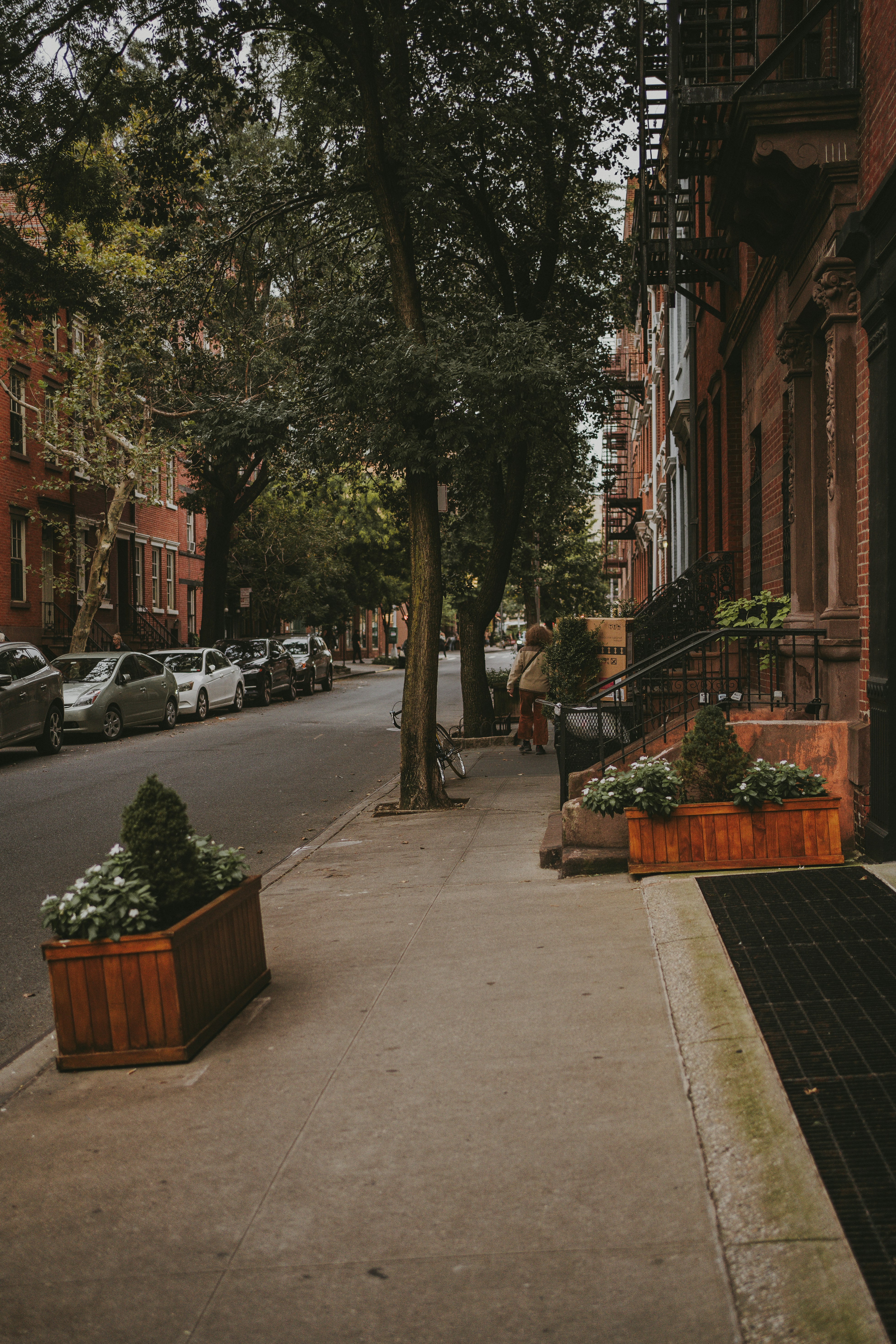 Side Street Reverie: Planter Boxes, Brownstones, and a Distant Pedestrian