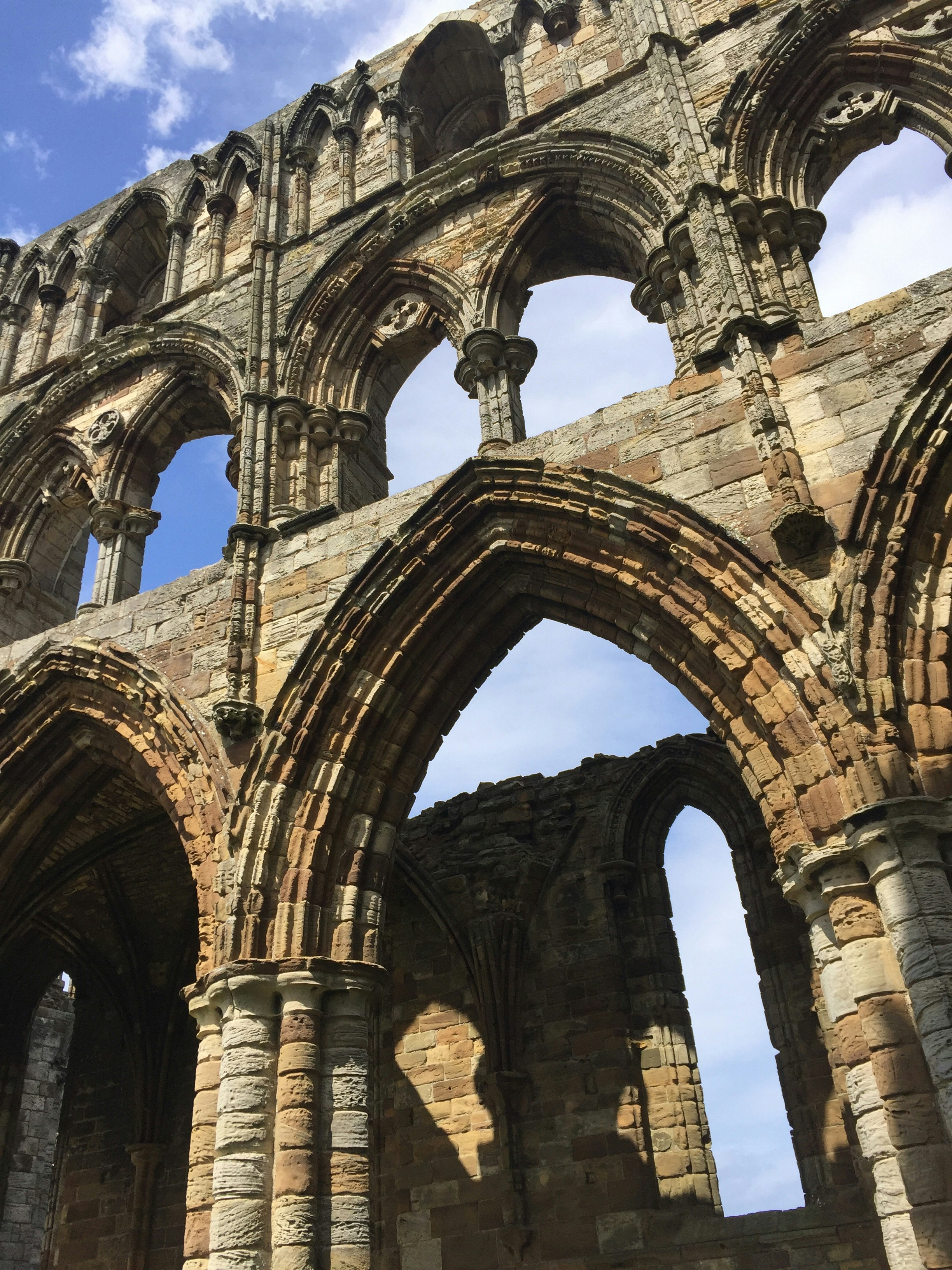 A large stone building with arches and arches photo – Free Whitby Image ...