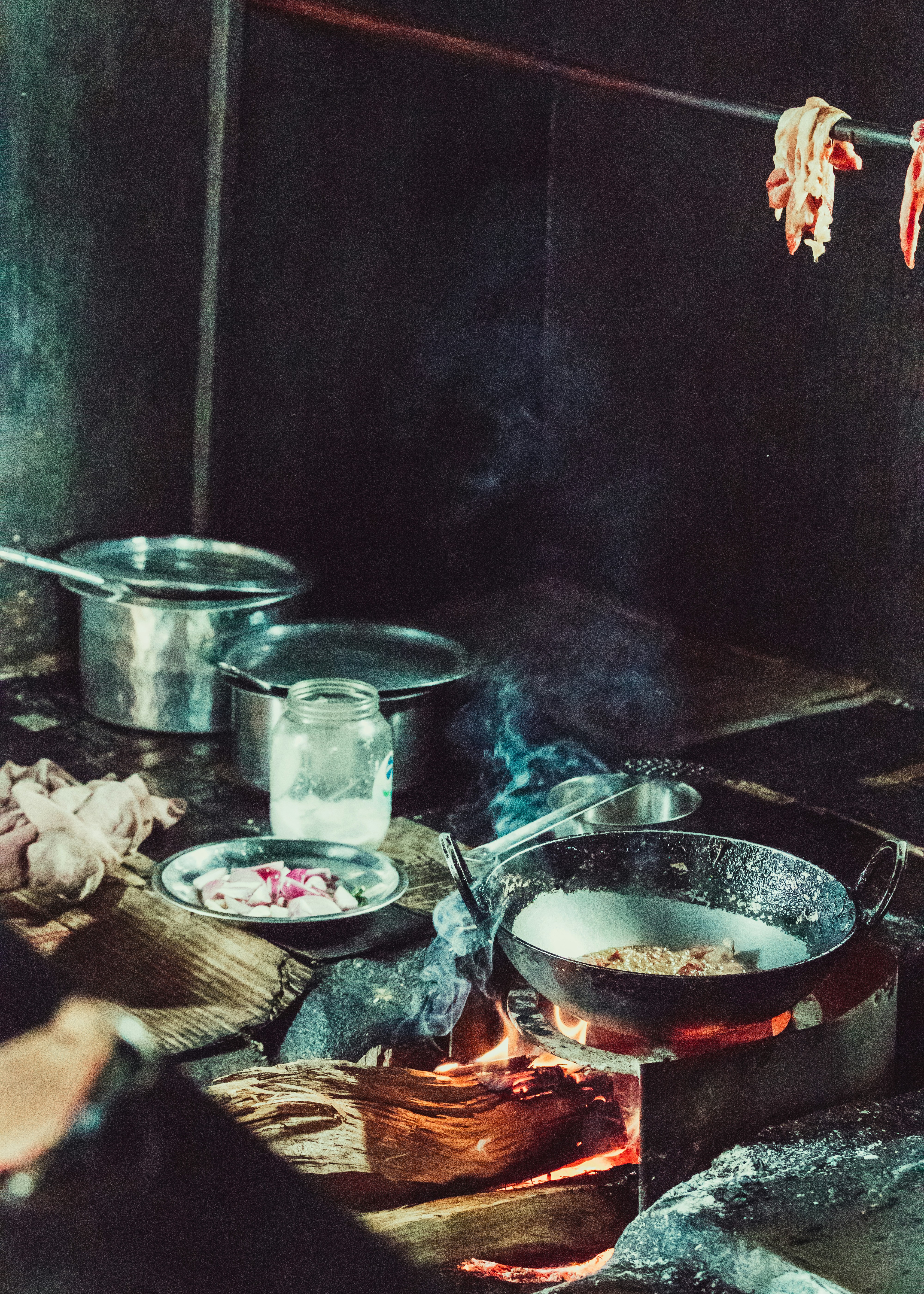 A person cooking food on a stove in a kitchen photo – Free Meghalaya ...