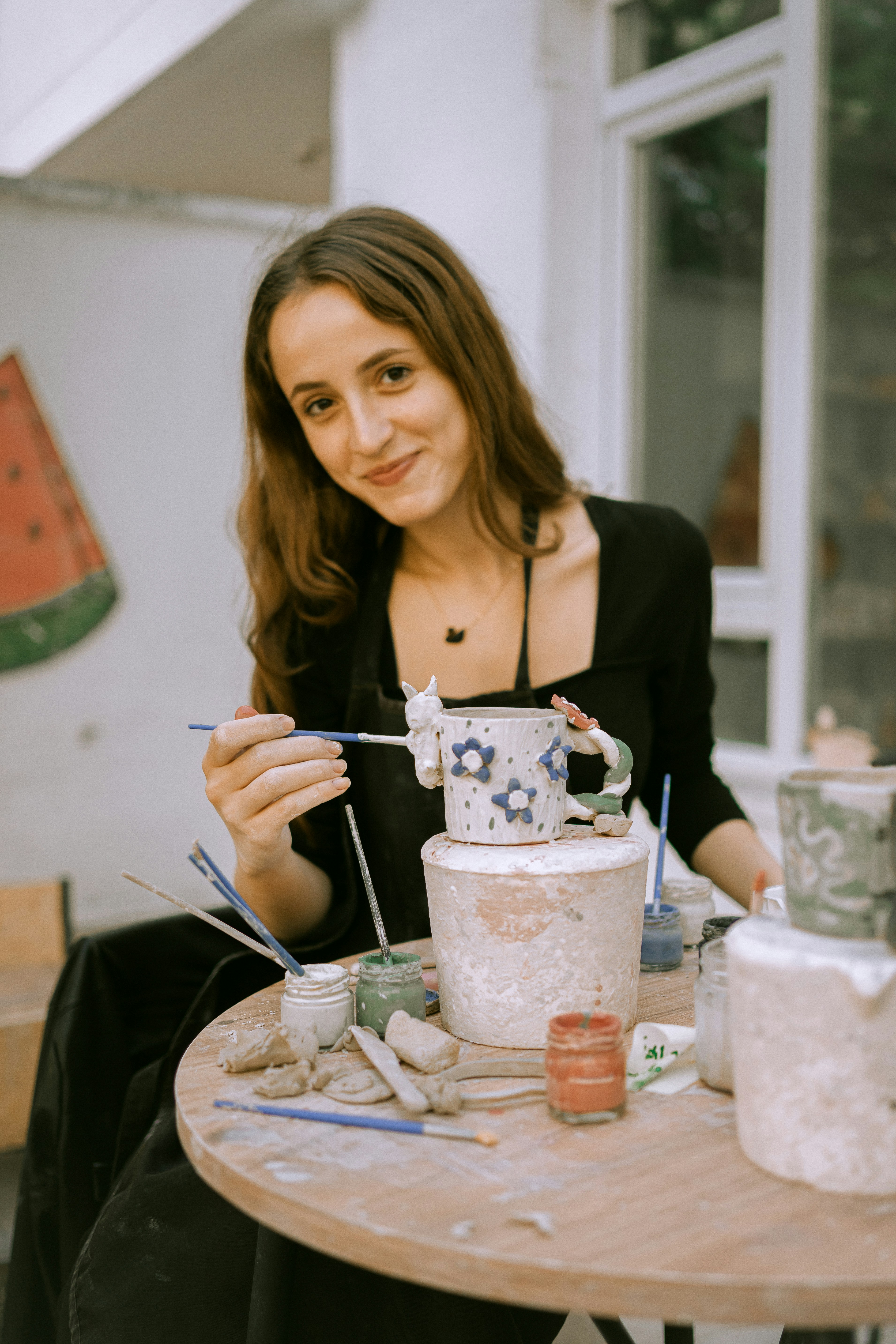 Portrait of a Ceramic Artist At Her Craft Table