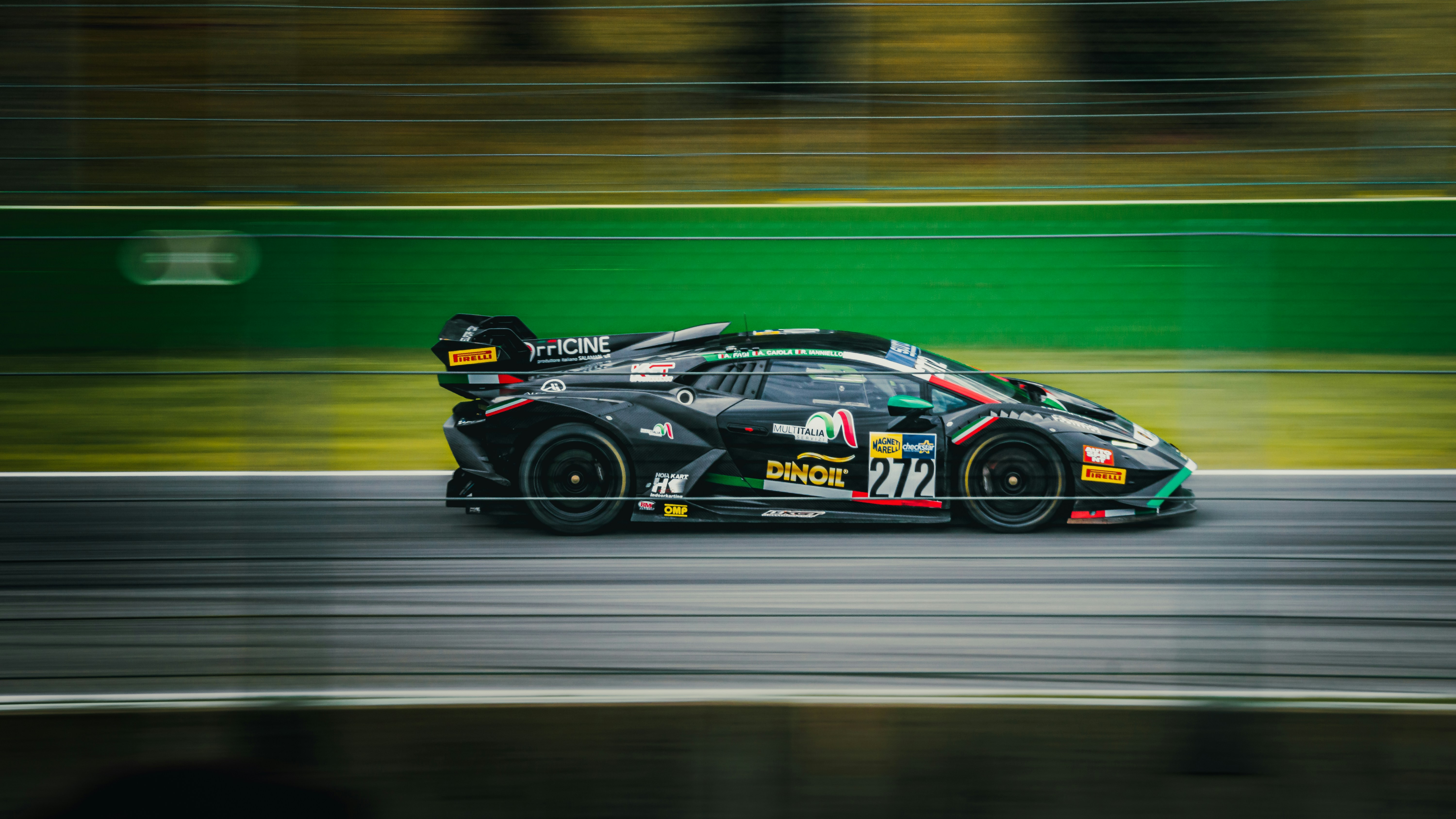 A racing car driving down a race track photo – Free Monza Image on Unsplash