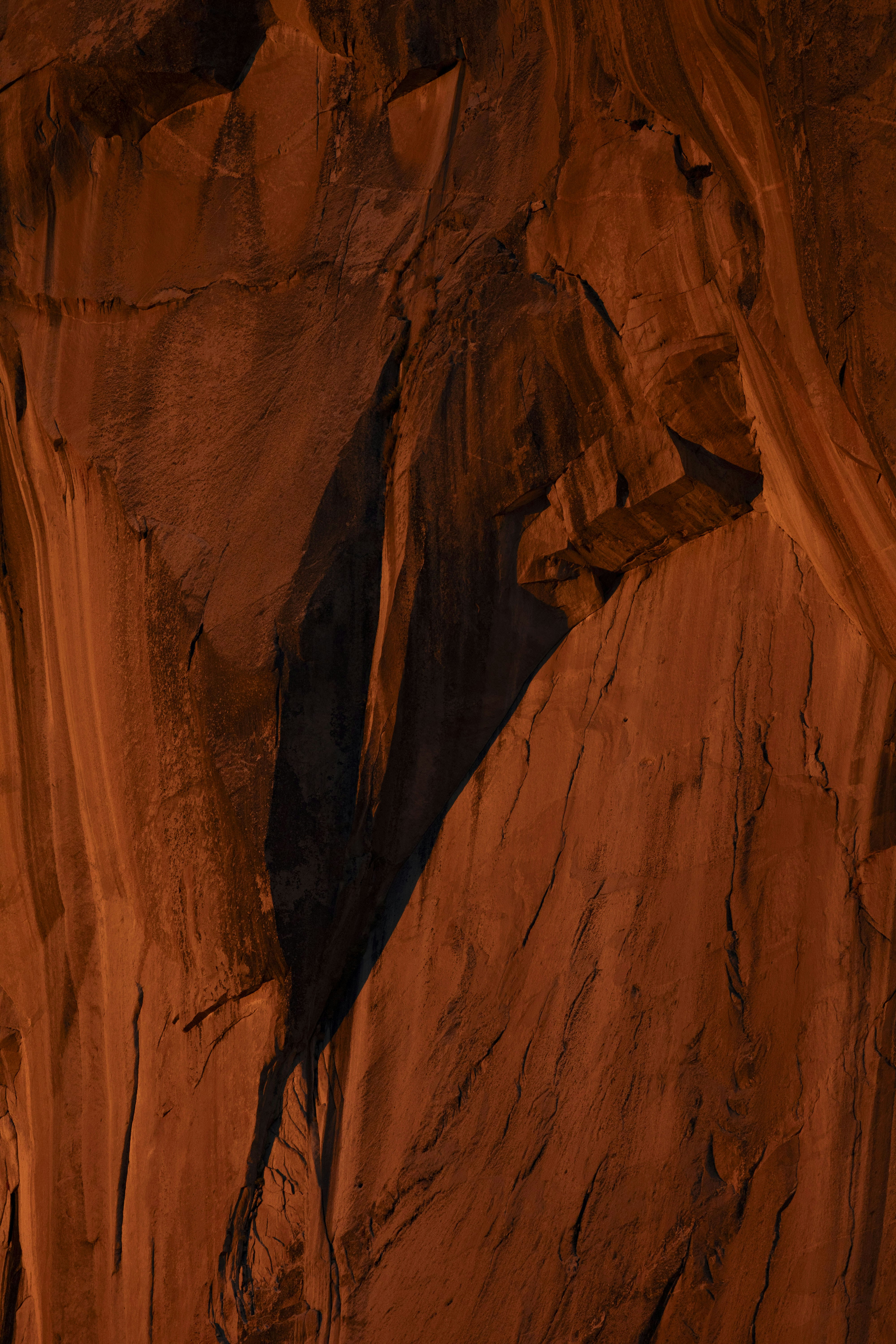 A rock face with a very long shadow on it photo – Free Black Image on ...
