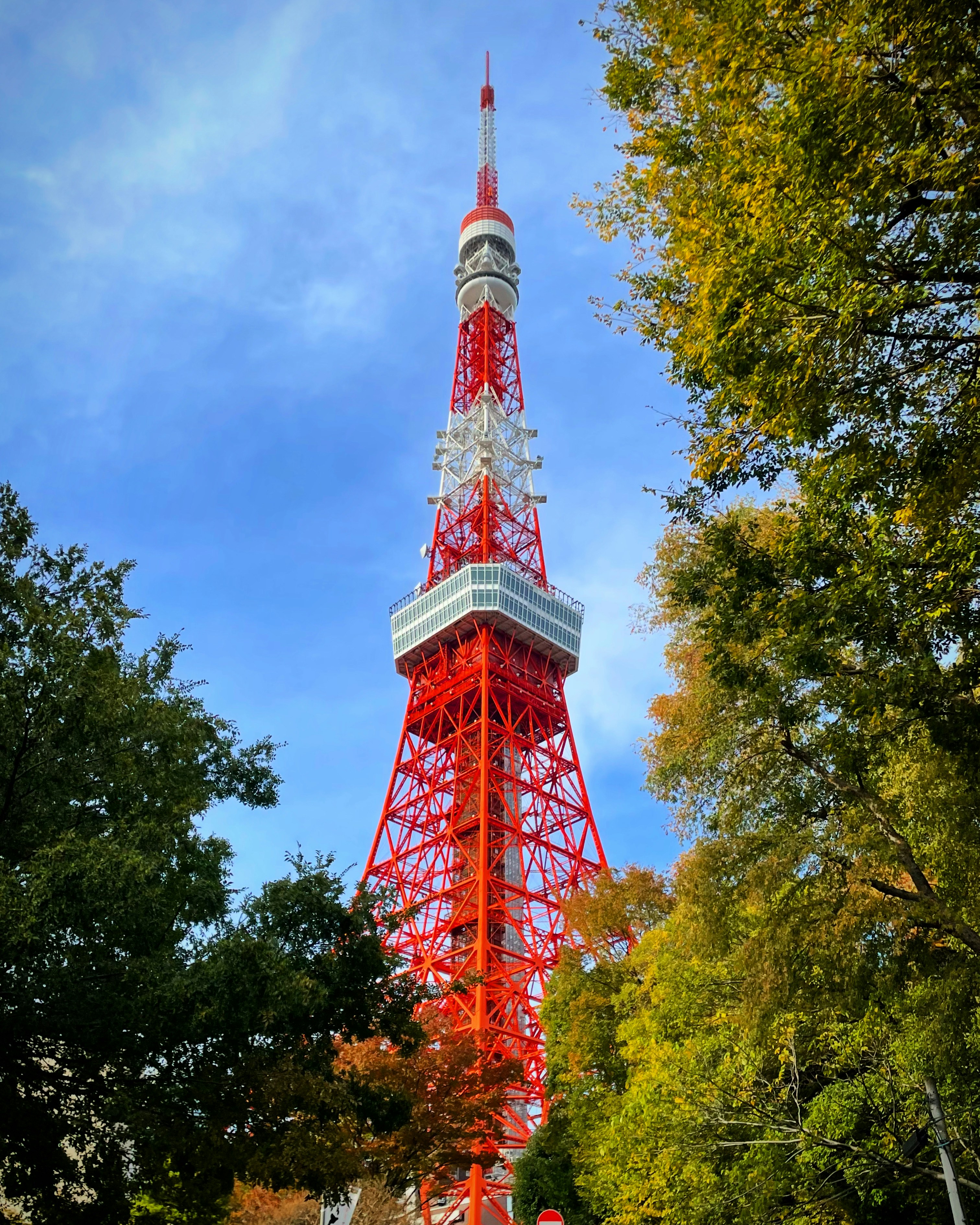 A tall red tower with a sky background photo – Free Building Image on ...