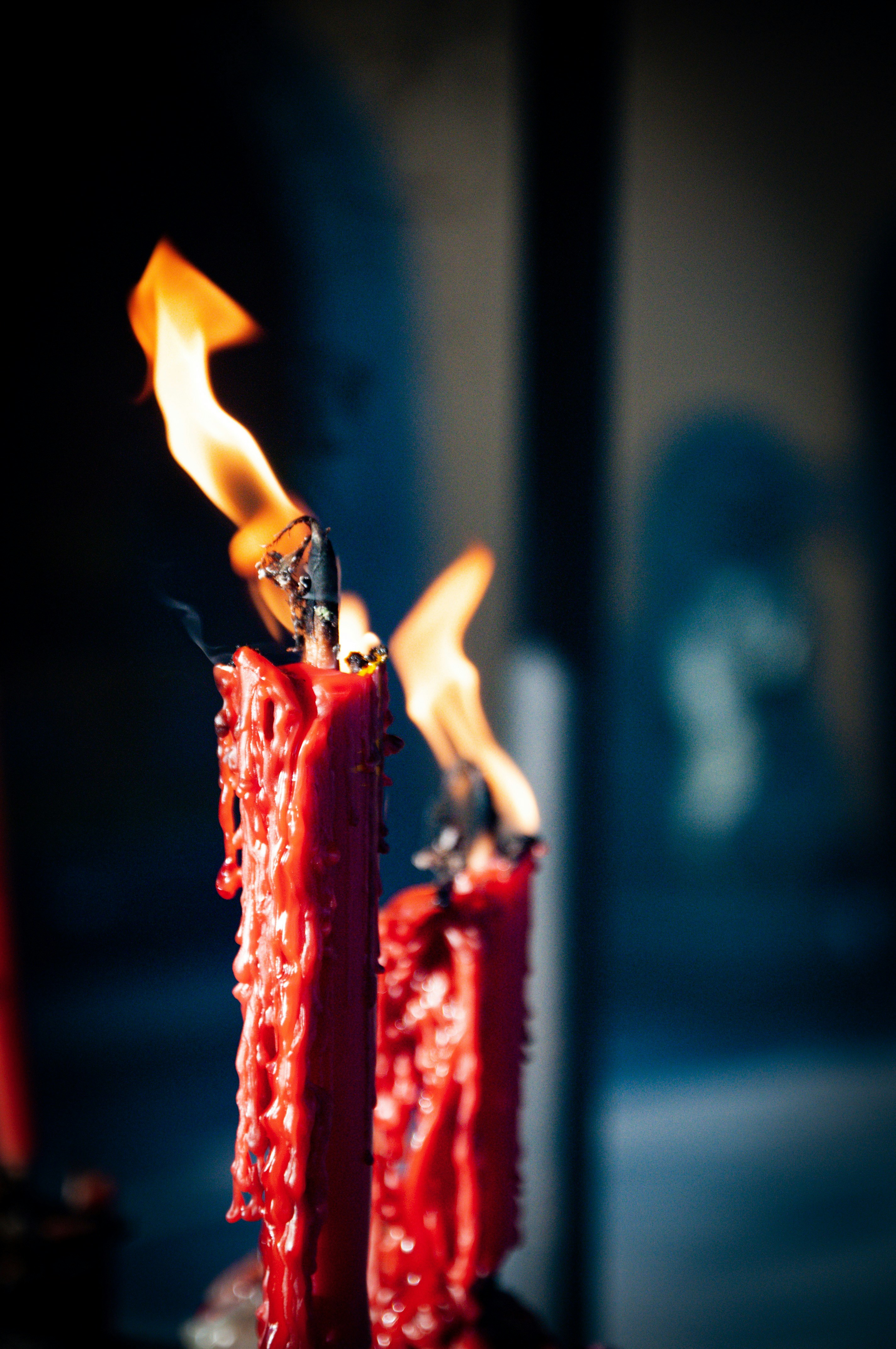 Crimson Drips and Quiet Flames: A Candlelit Macro Moment