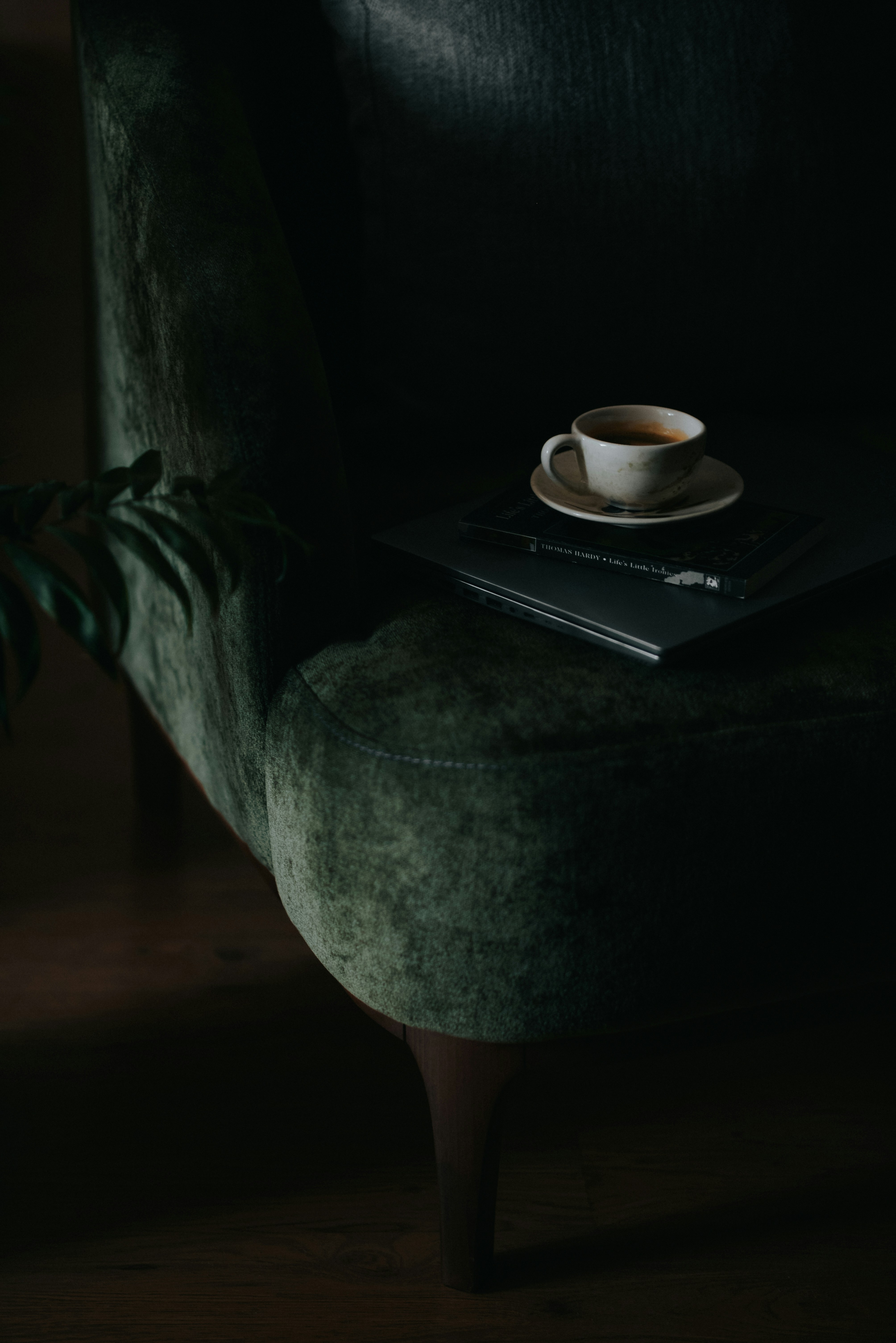 Steam in Velvet Quiet: A Coffee Moment on a Dark Corner Chair