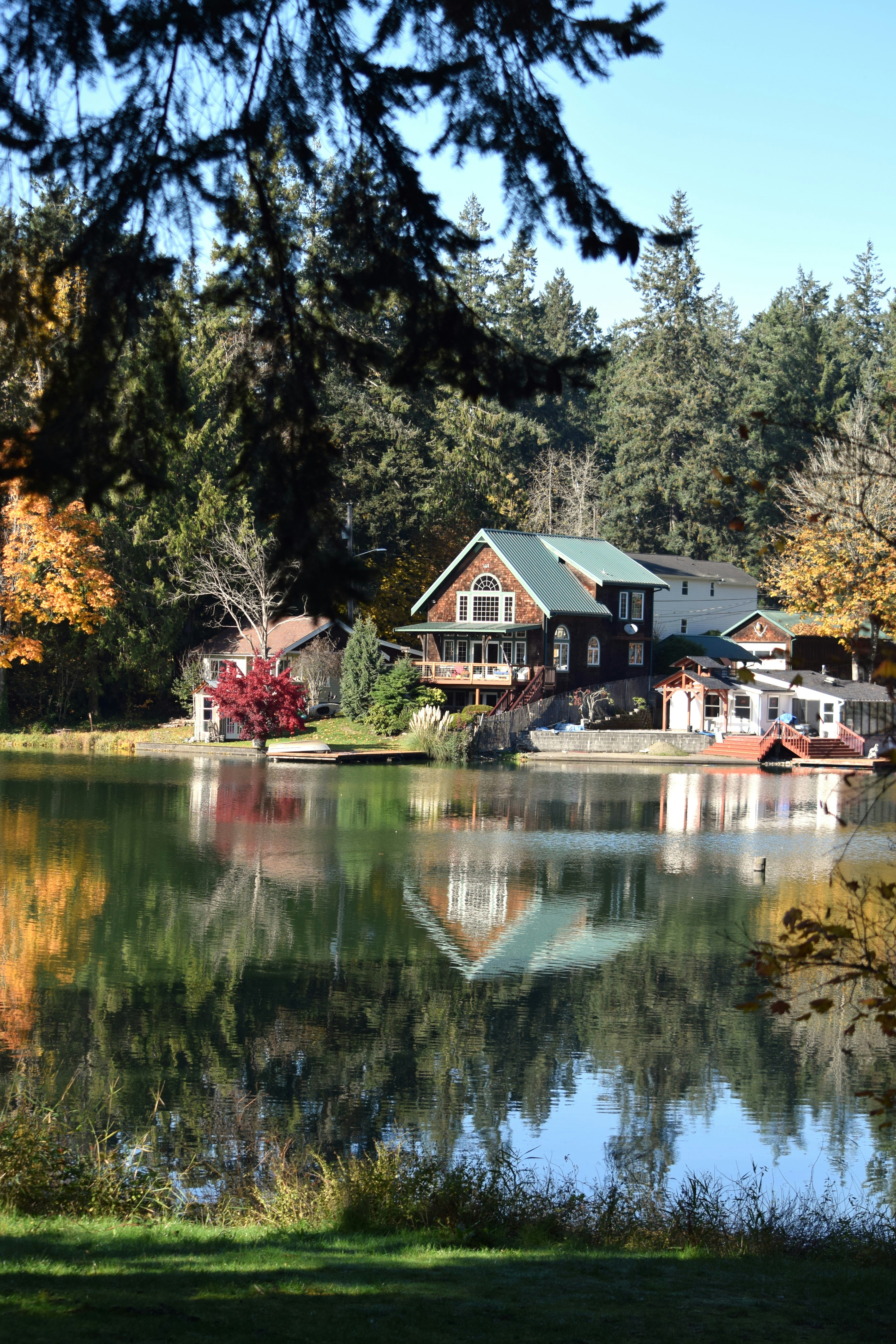 Autumn Light on a Lakeside Chalet and Its Glassy Reflection