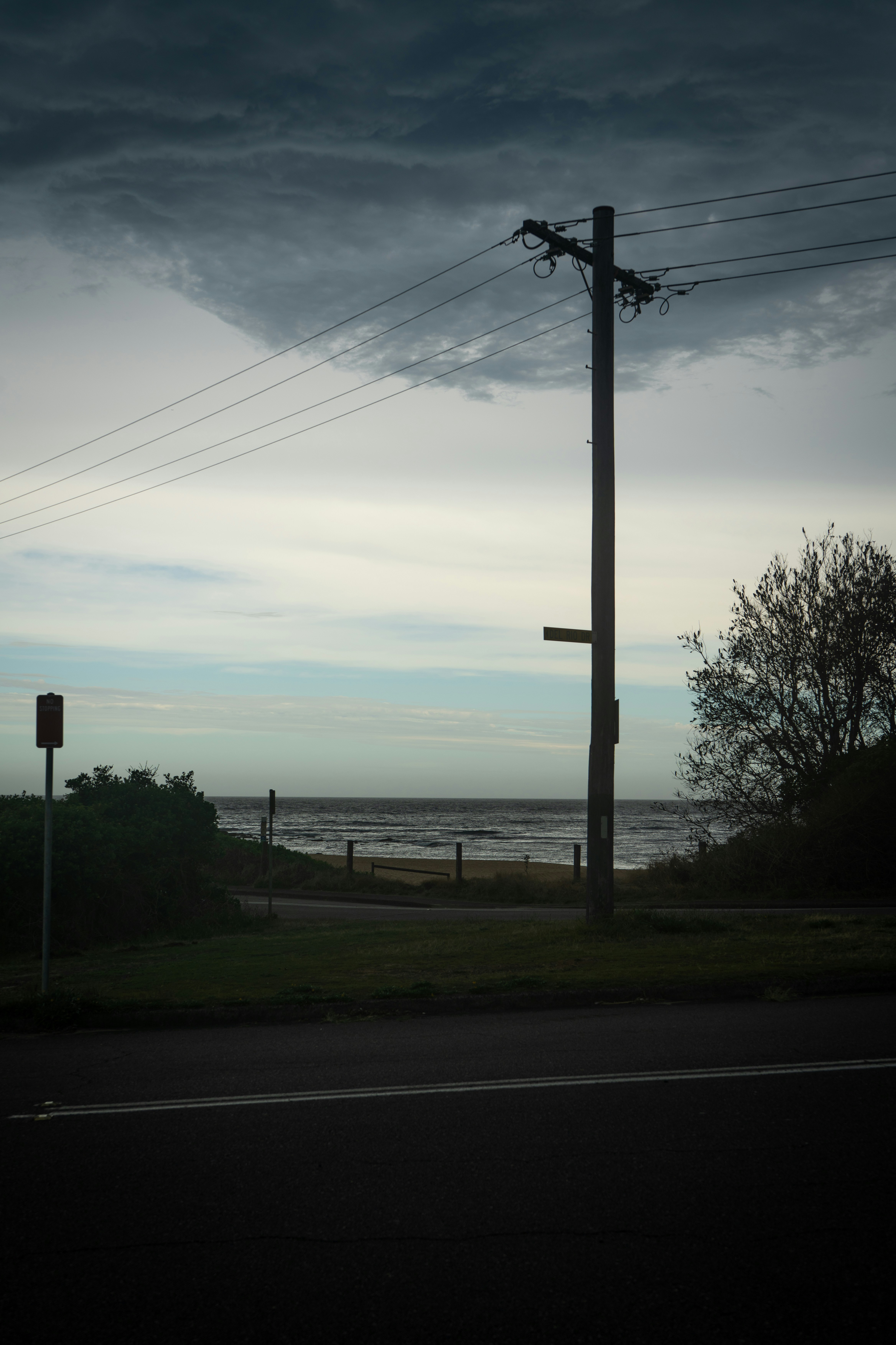 Pole at the Sea's Edge: Dusk Lines and a Quiet Horizon