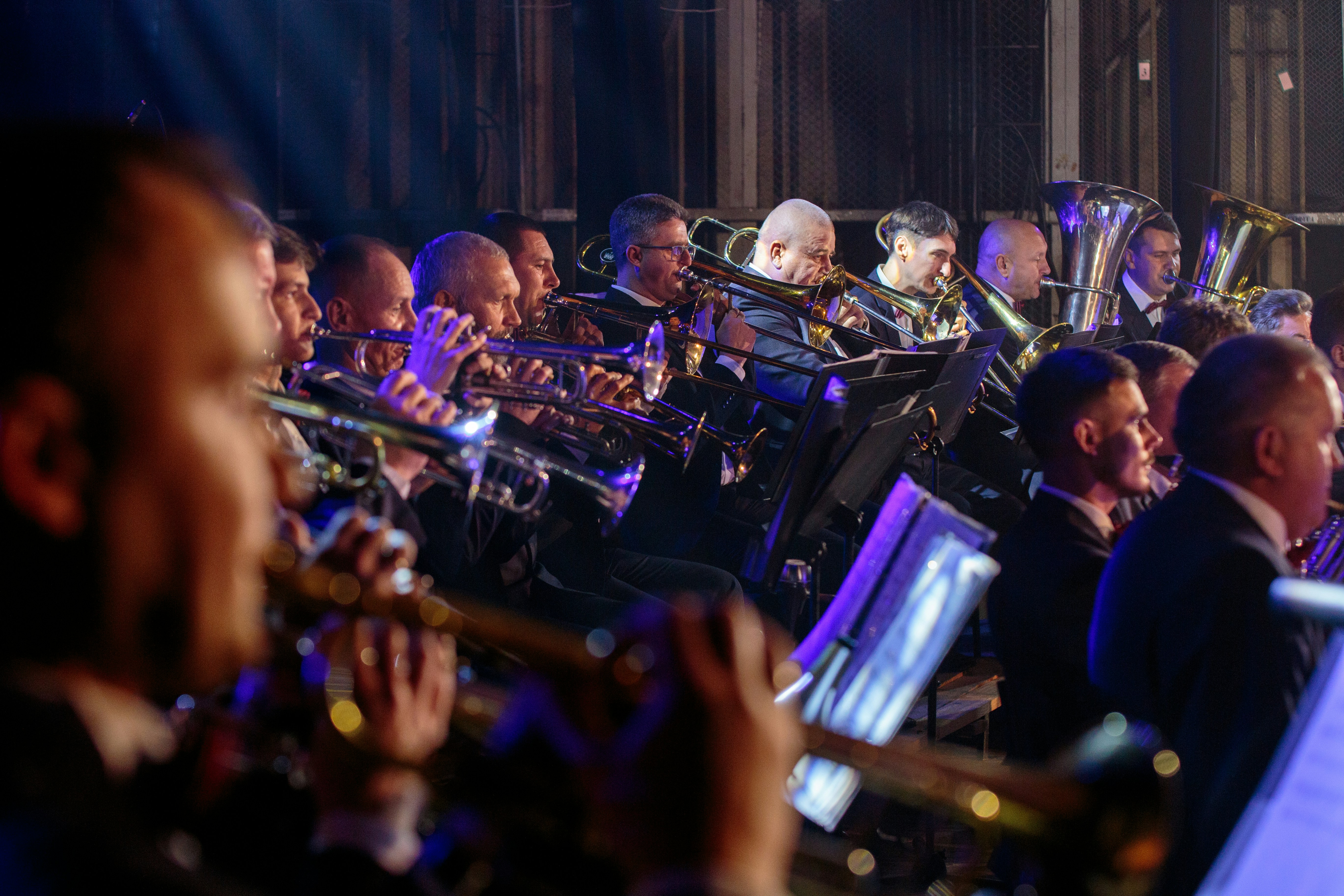 A group of men in suits and ties playing musical instruments photo ...