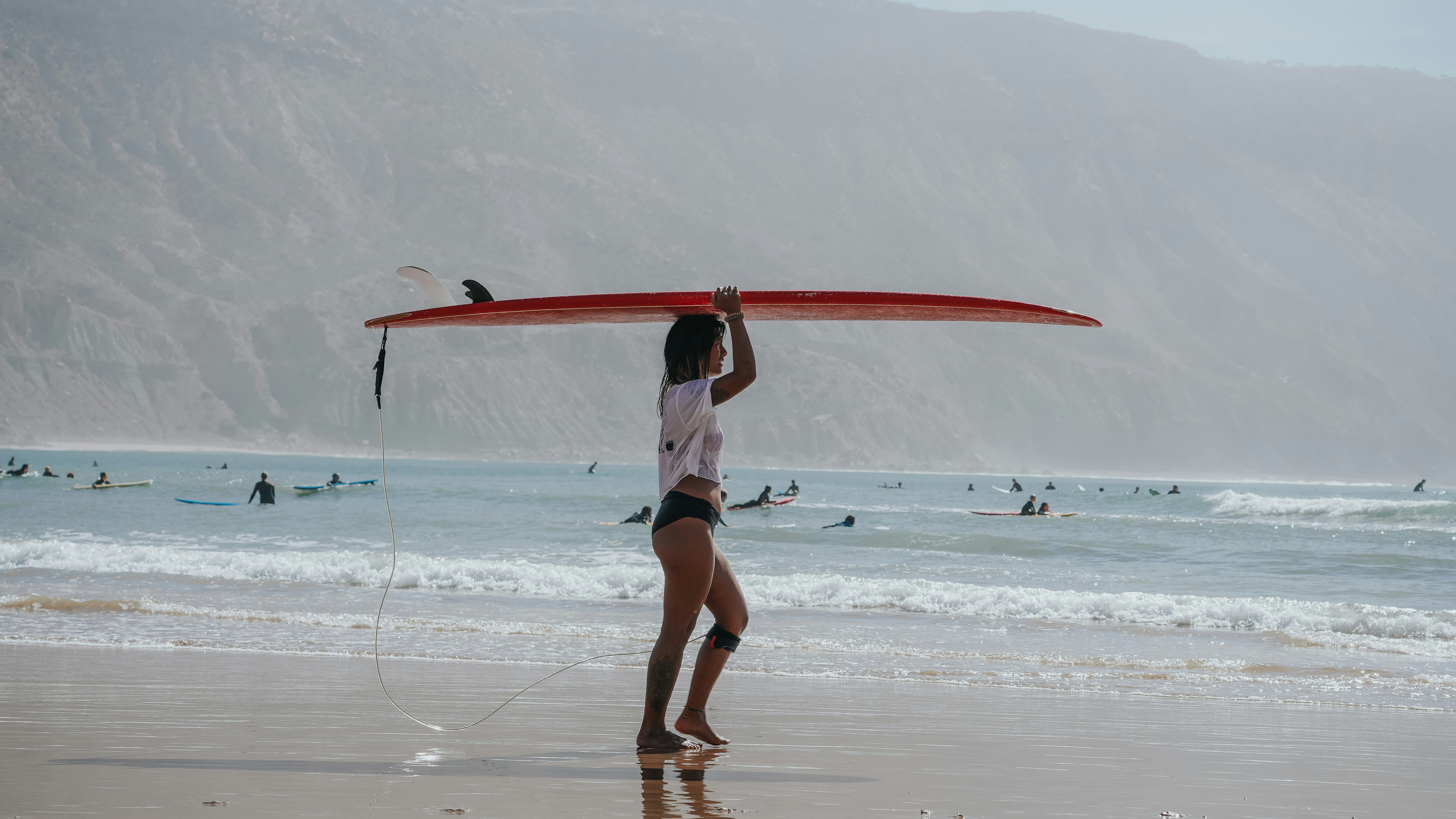 Crimson Board Lift: Quiet Morning on the Shore