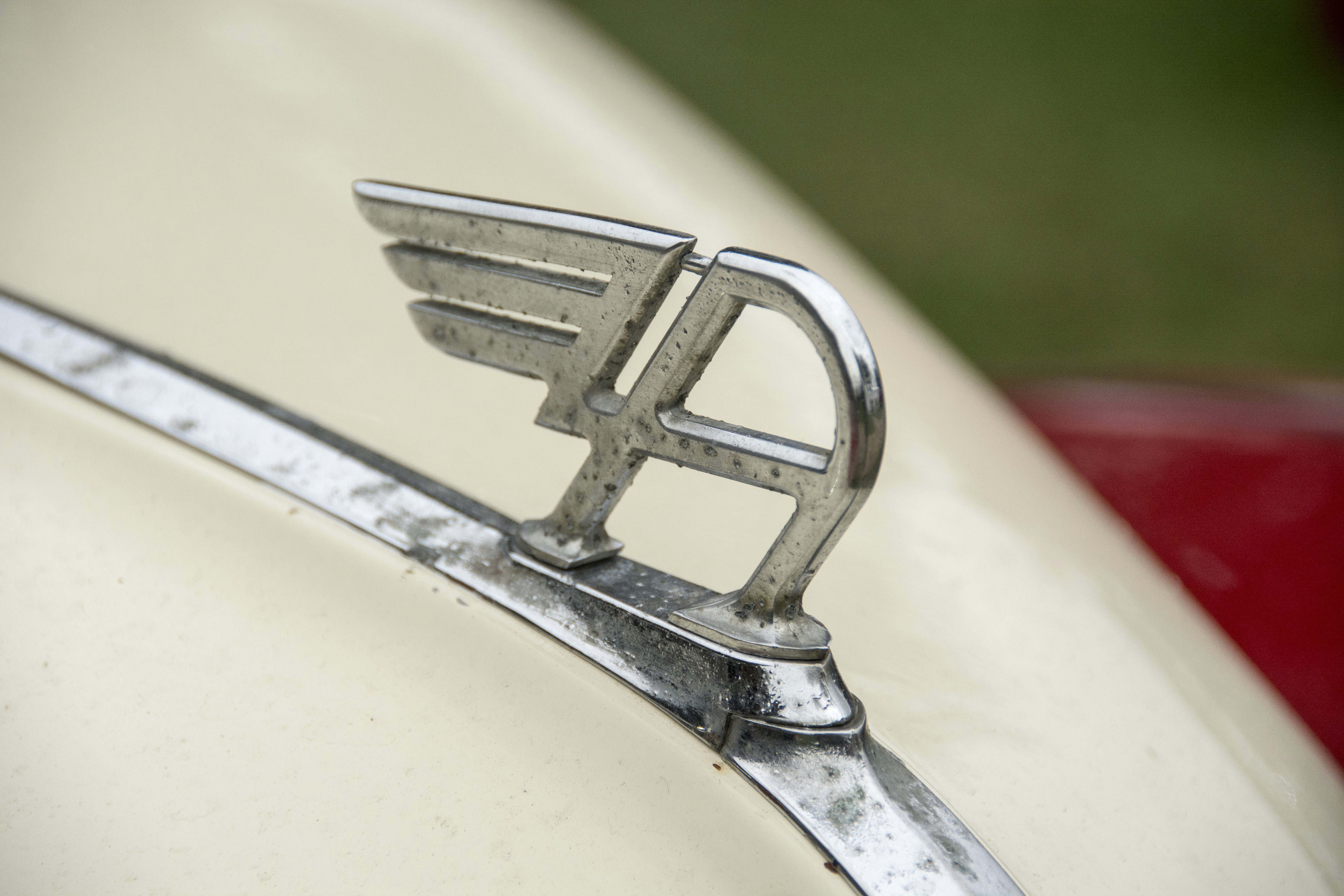 A close up of the emblem on a car photo – Free Chichester Image on Unsplash