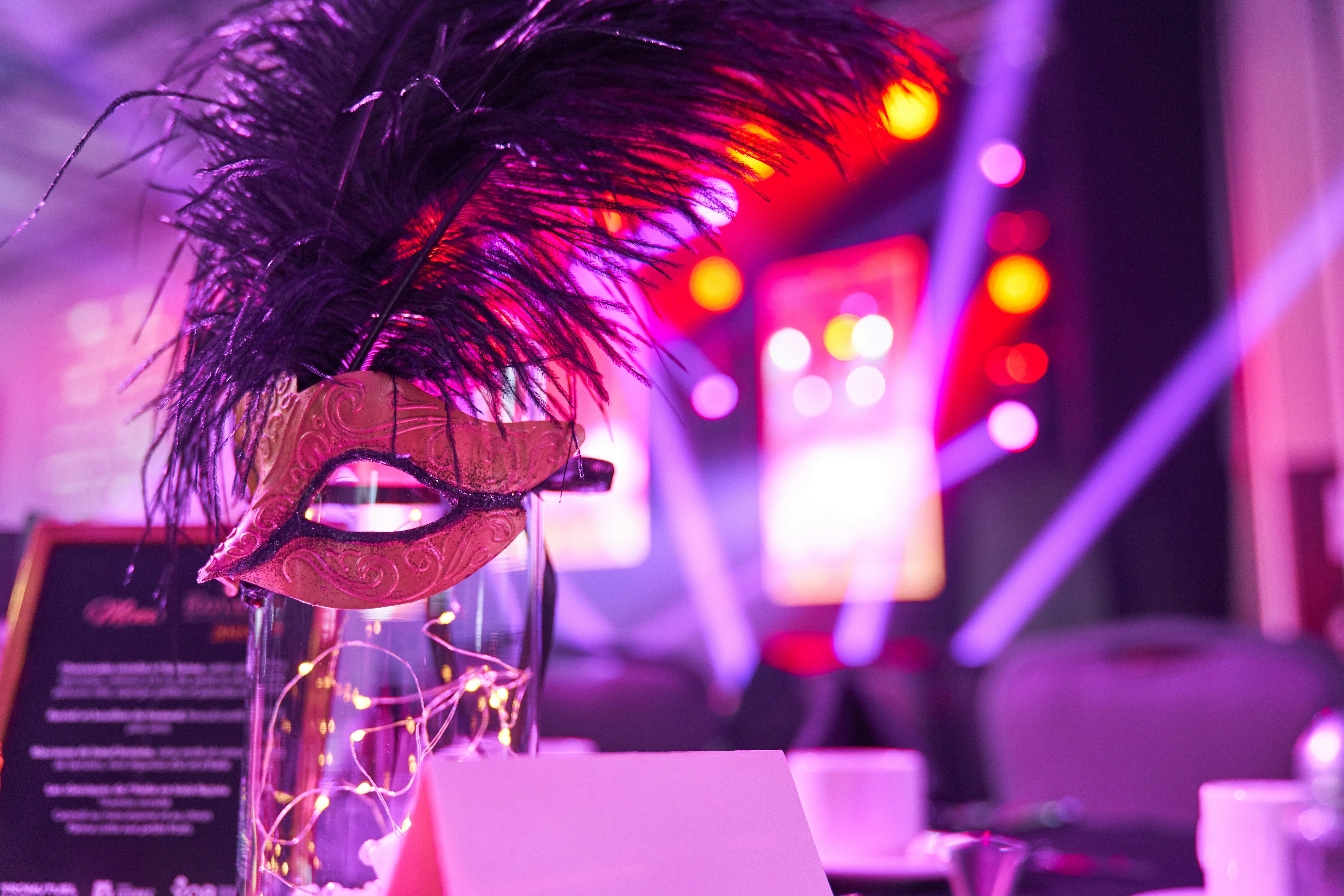 Feathered Mask in Neon-Glow Dinner Setting