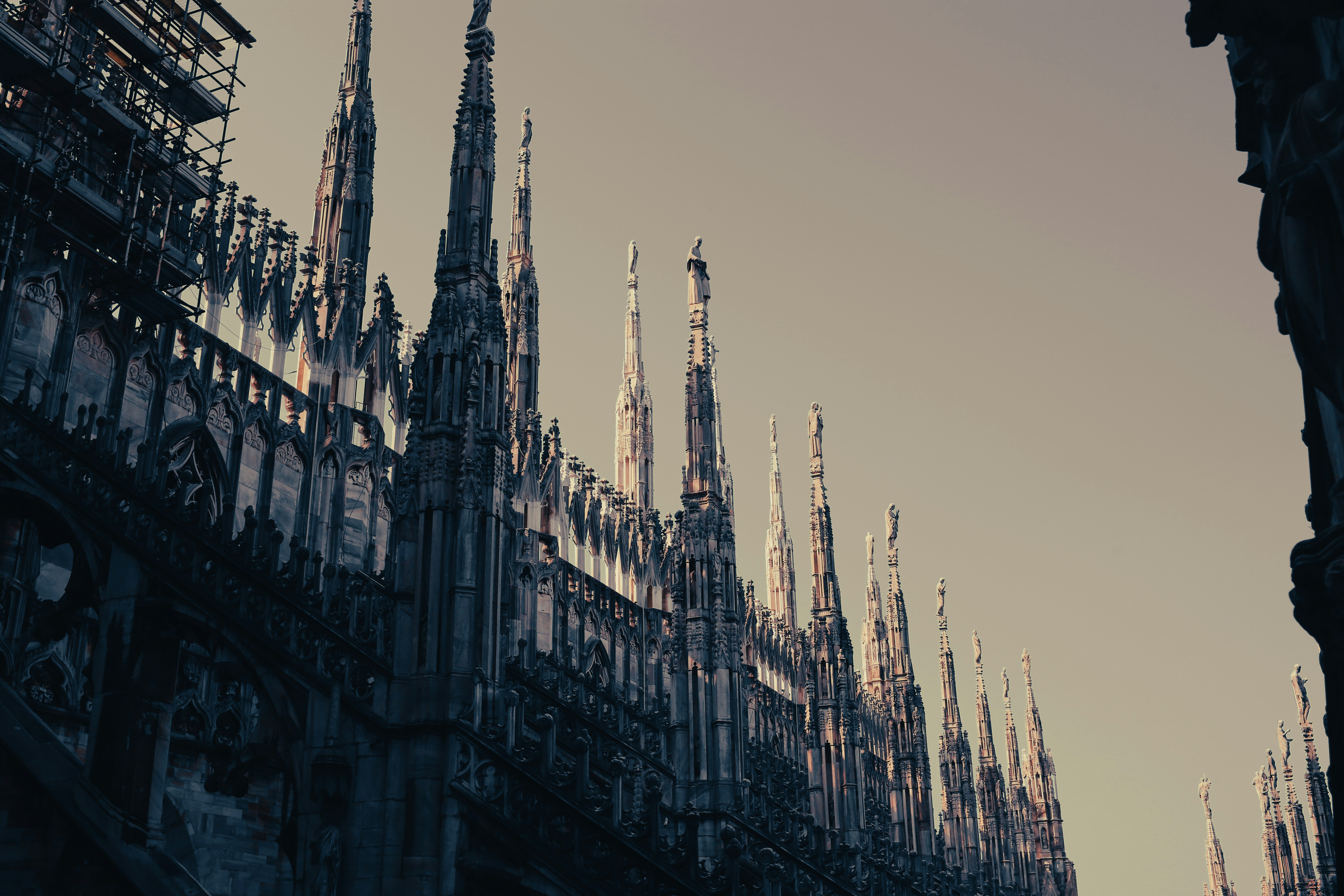 A very tall building with a lot of spires photo – Free Purple Image on ...