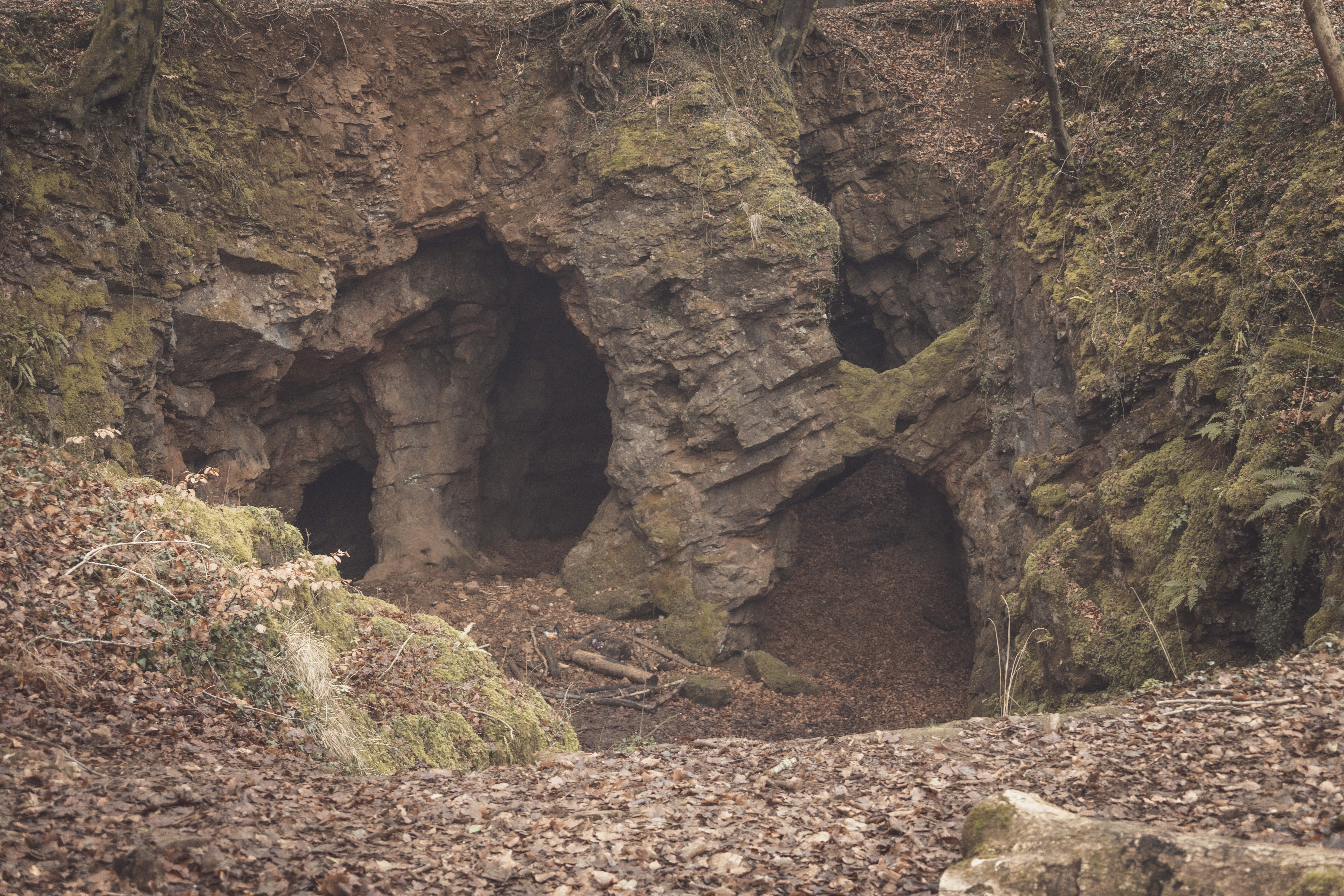 A cave in the side of a mountain photo – Free Foggy Image on Unsplash