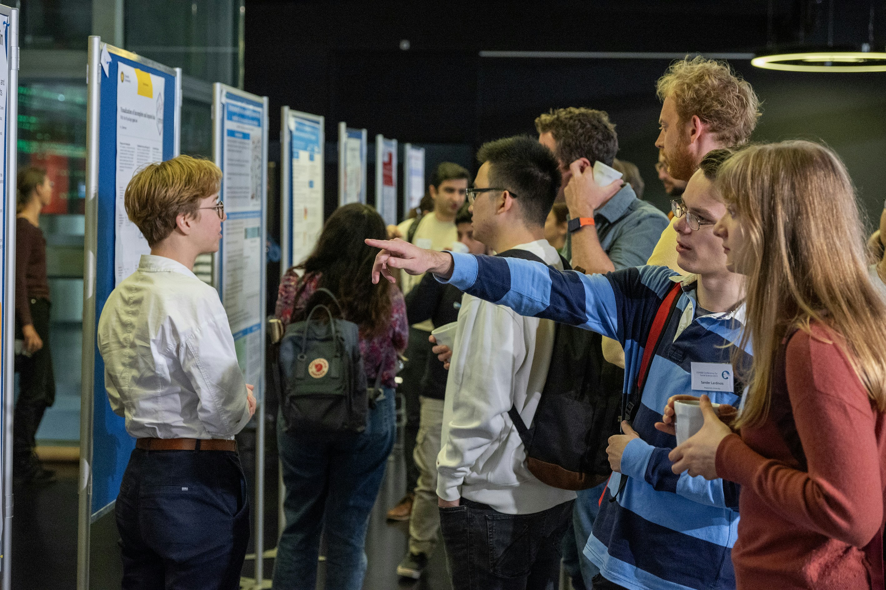 A group of people looking at a poster photo – Free Kid Image on Unsplash