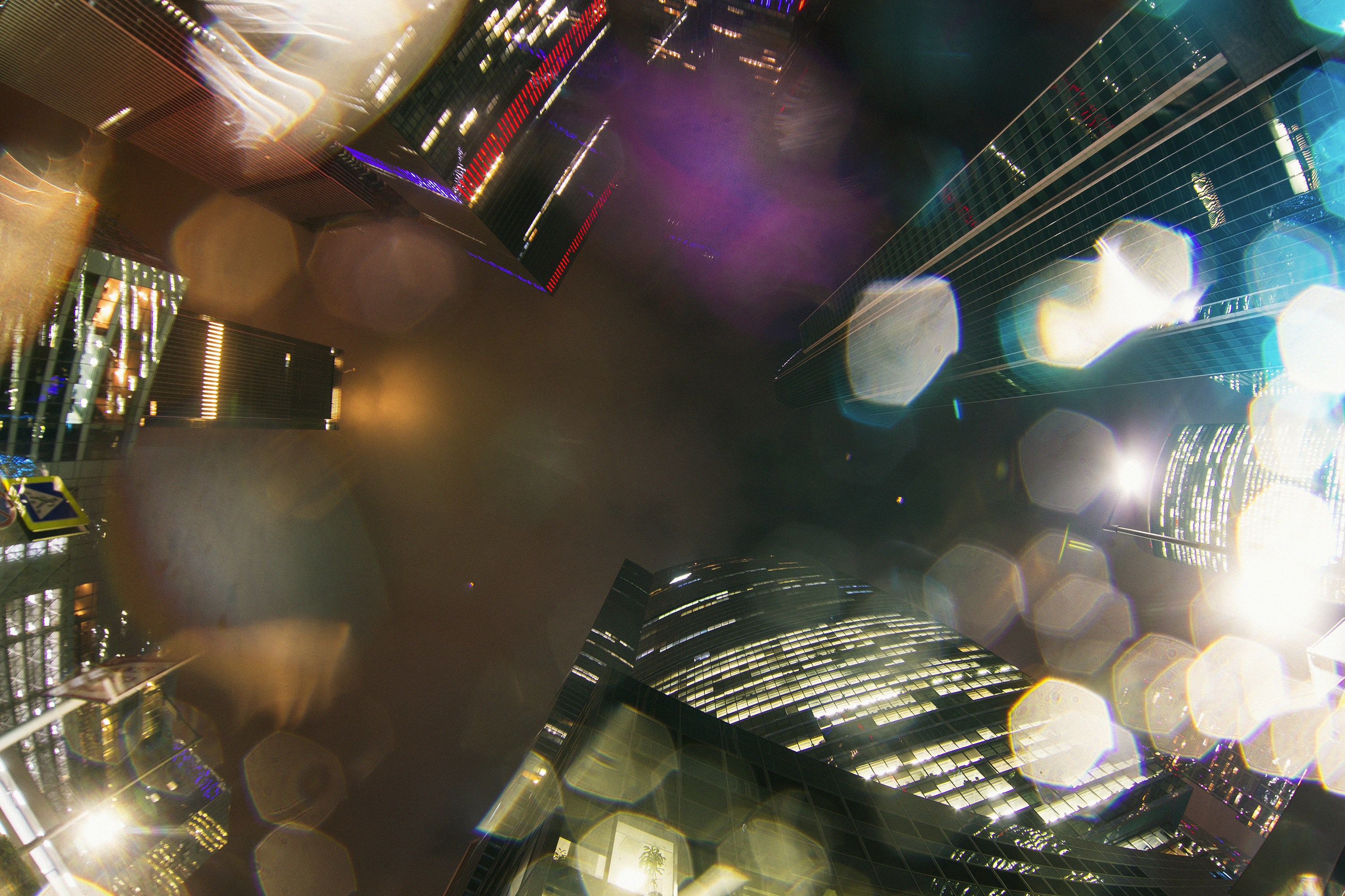 Neon Fables: Skyscrapers and Bokeh in Tilted Night