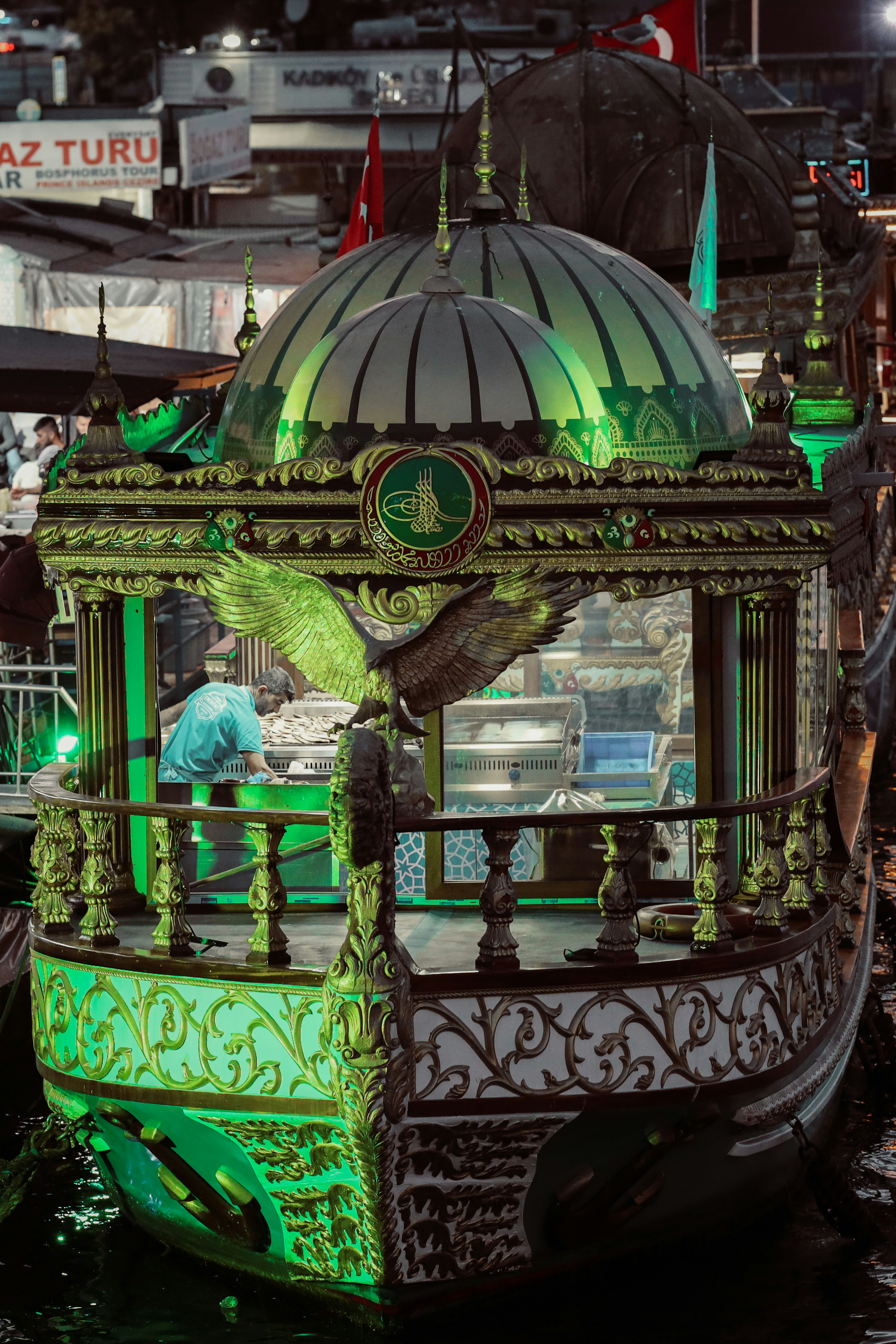 The Green Spectral Barque: Neon-Illuminated Ornate Vessel at the Night Market
