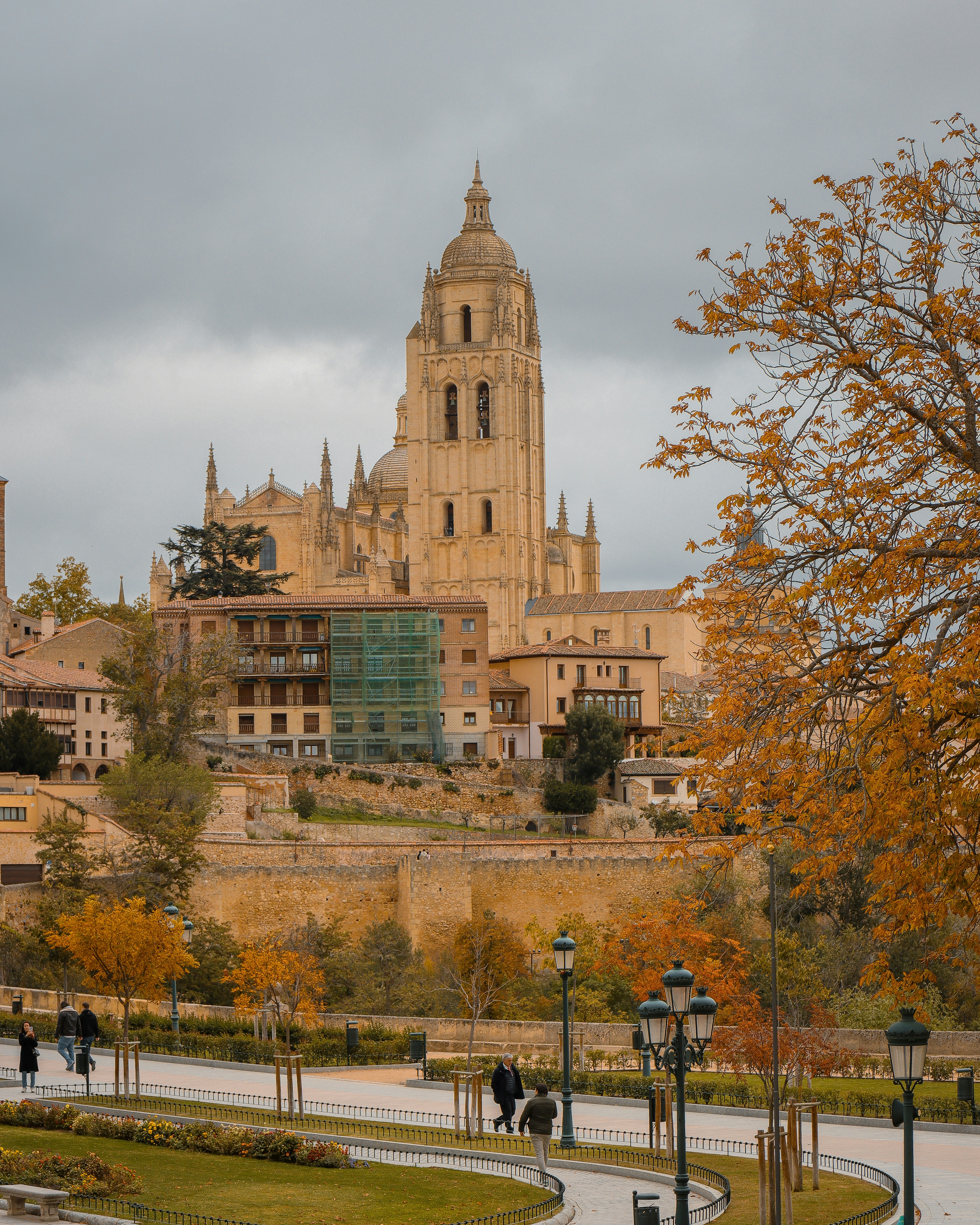 Towering Cathedral Over an Autumn-Glow Riverside Promenade
